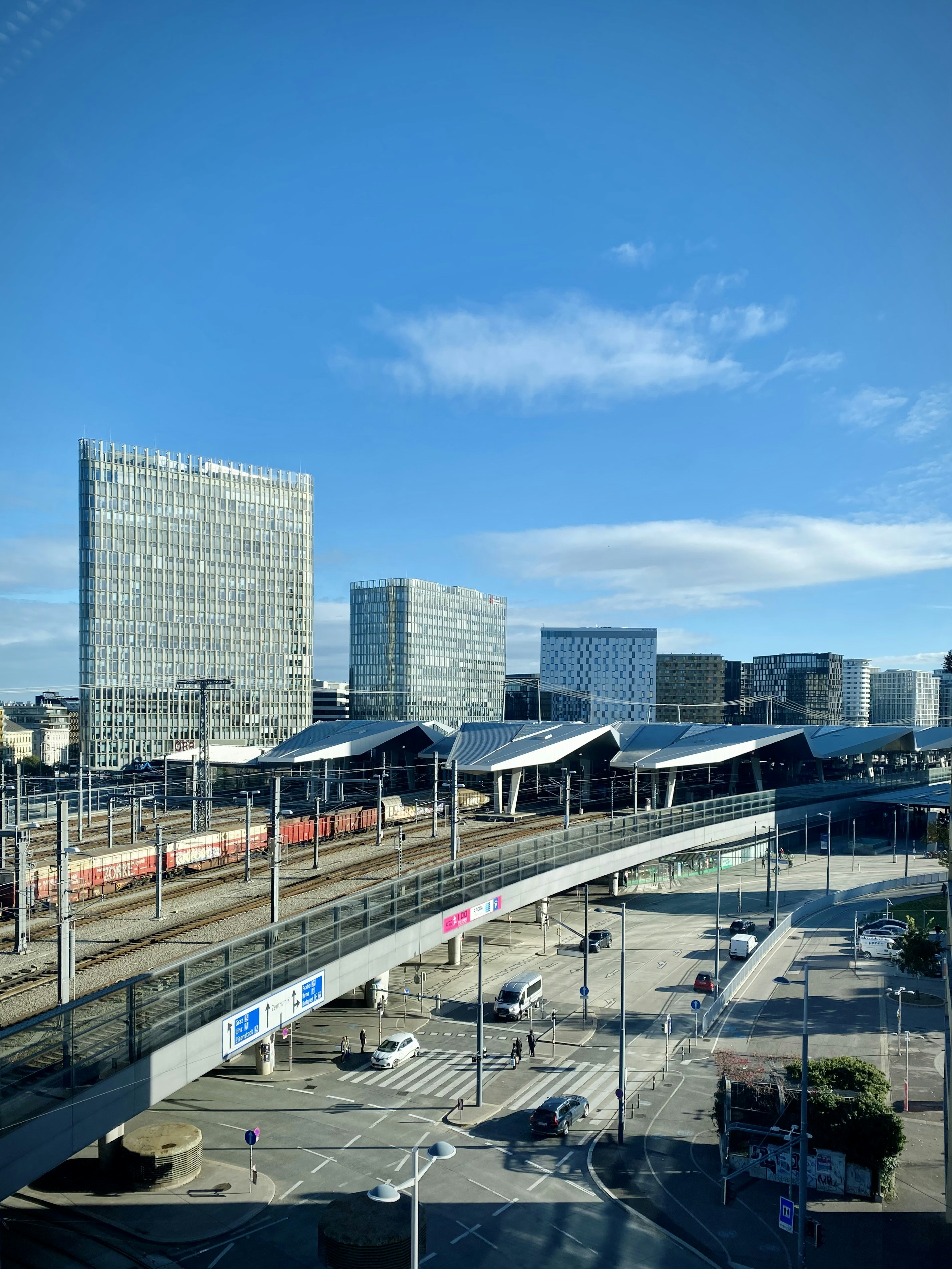 Glass Towers Framing a Modern Transit Spine
