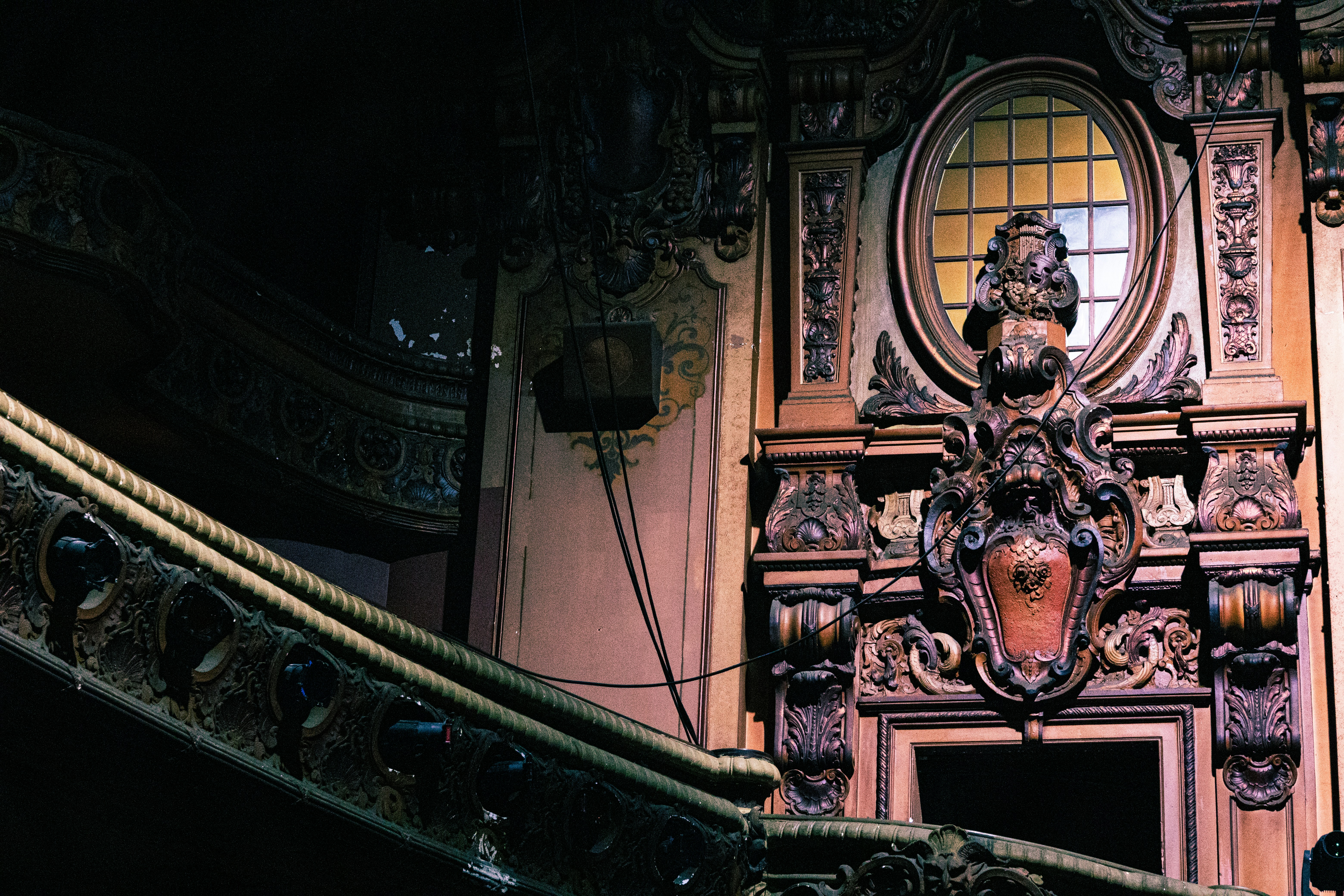Gilded Crest Above the Velvet Rail: A Baroque Theater Portrait