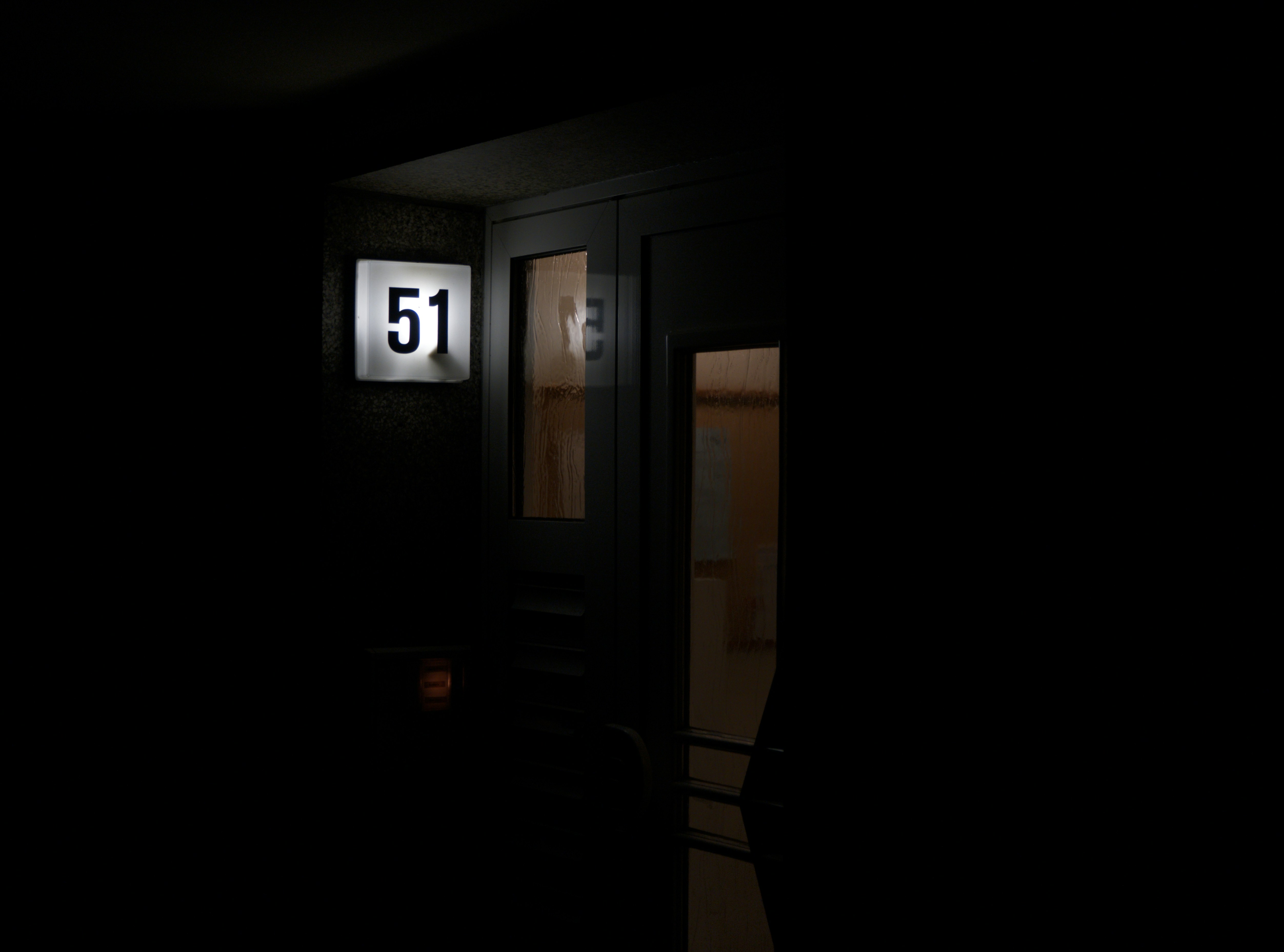 Doorway Sign 51: A Subtle Beacon in the Darkness