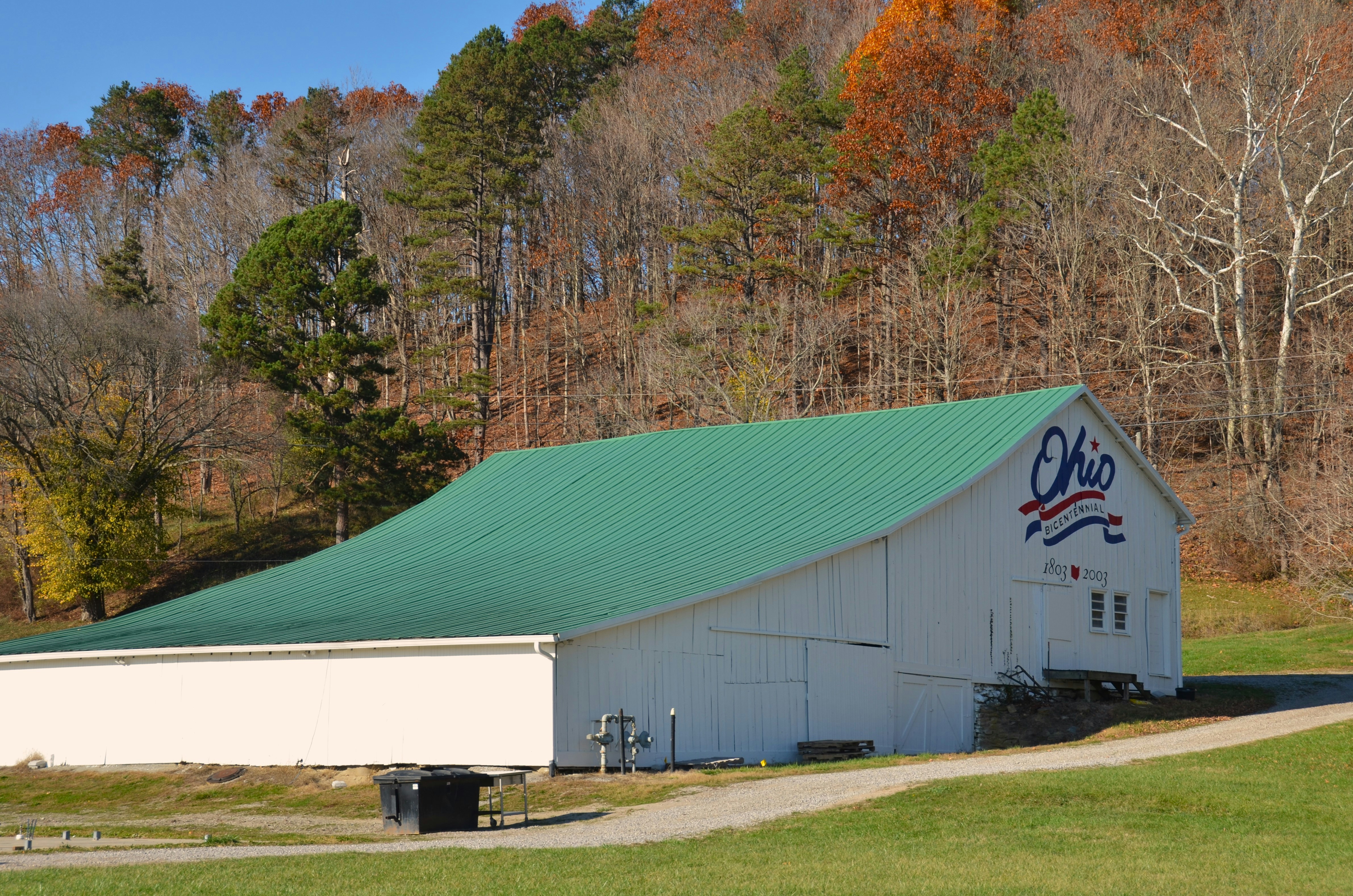 A large white barn with a green roof photo – Free Nature Image on Unsplash