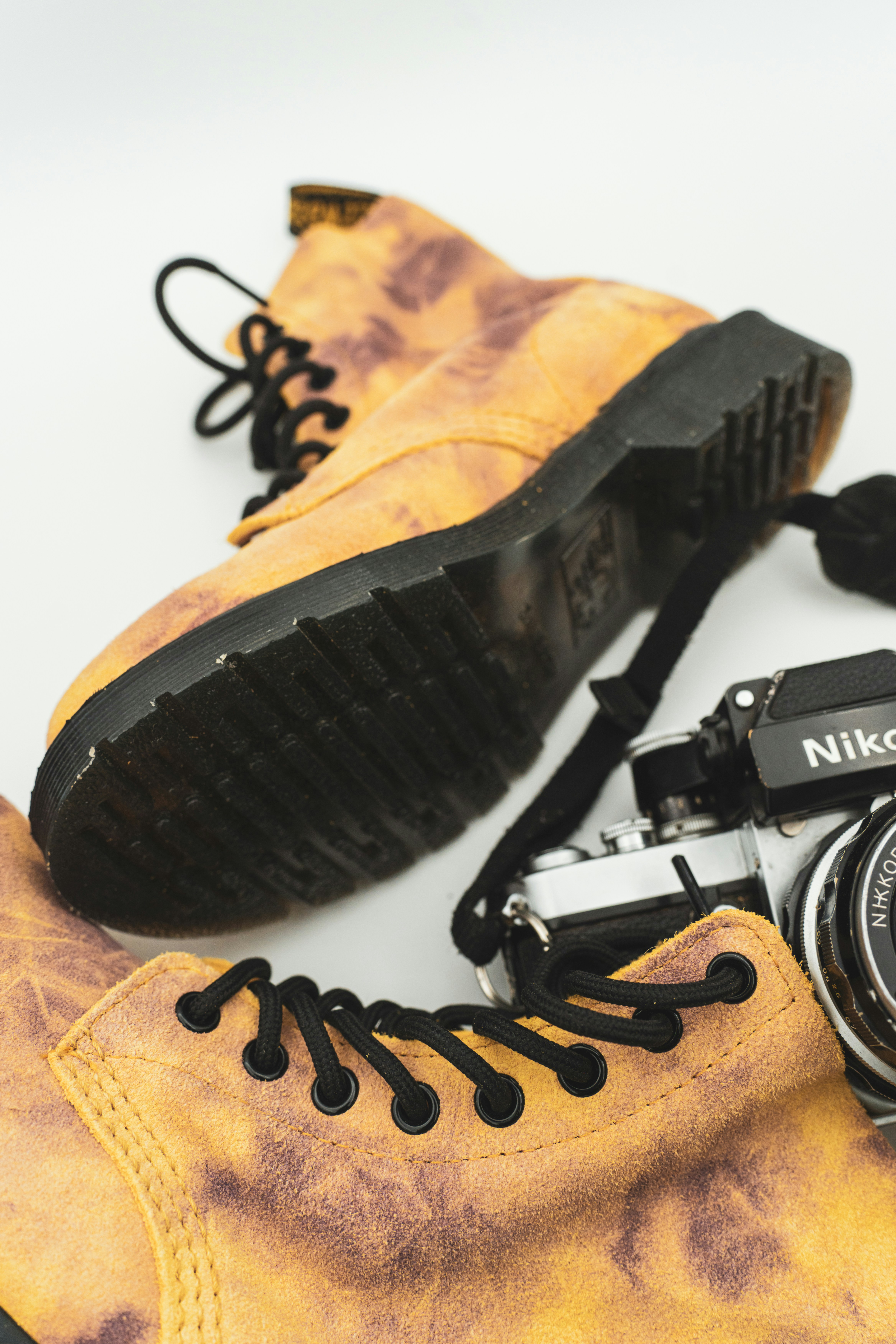 A pair of hiking boots, a camera, and a pair of hiking boots photo ...
