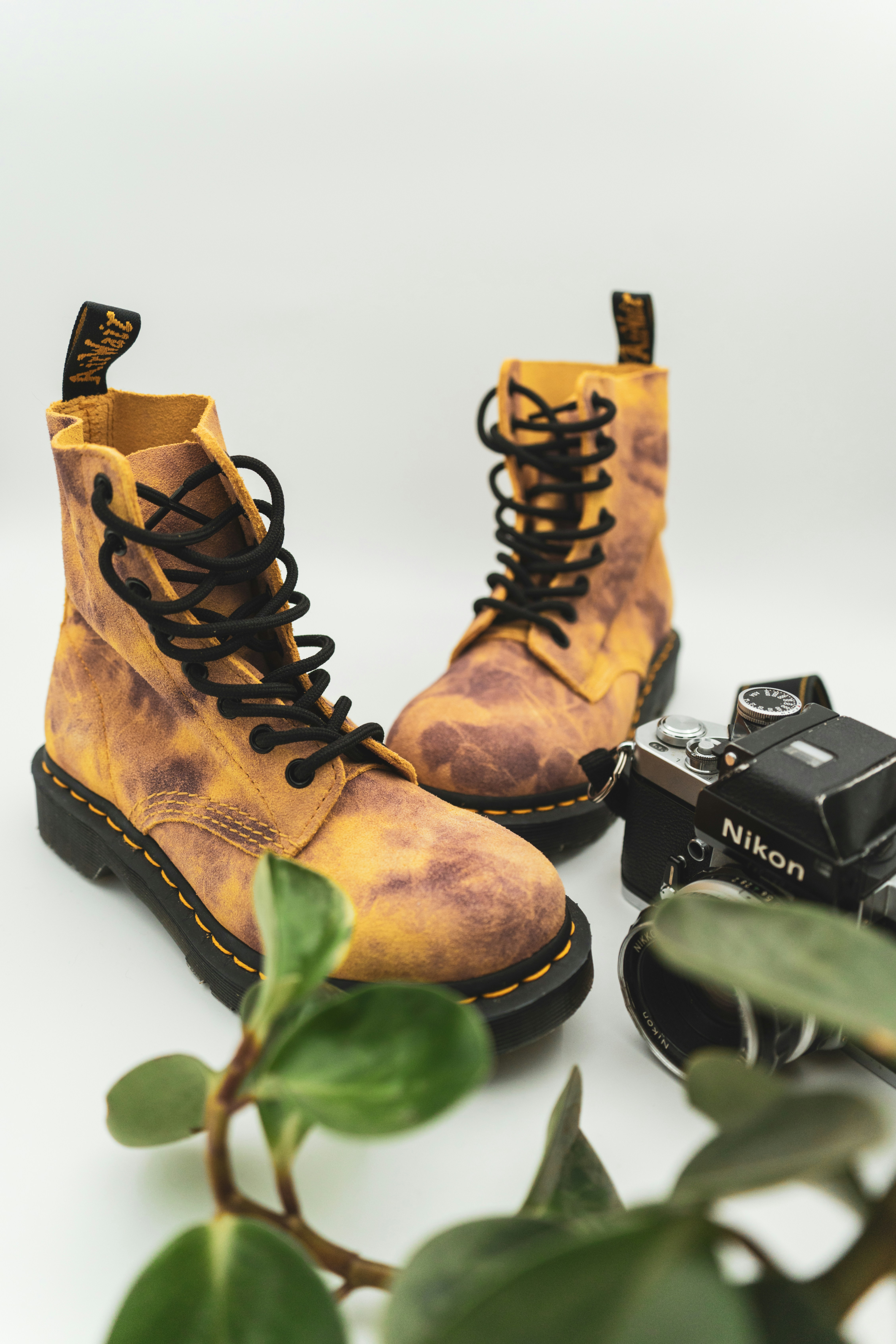 Dust-Tinted Boots Meet a Silent Nikon in a Minimal Studio