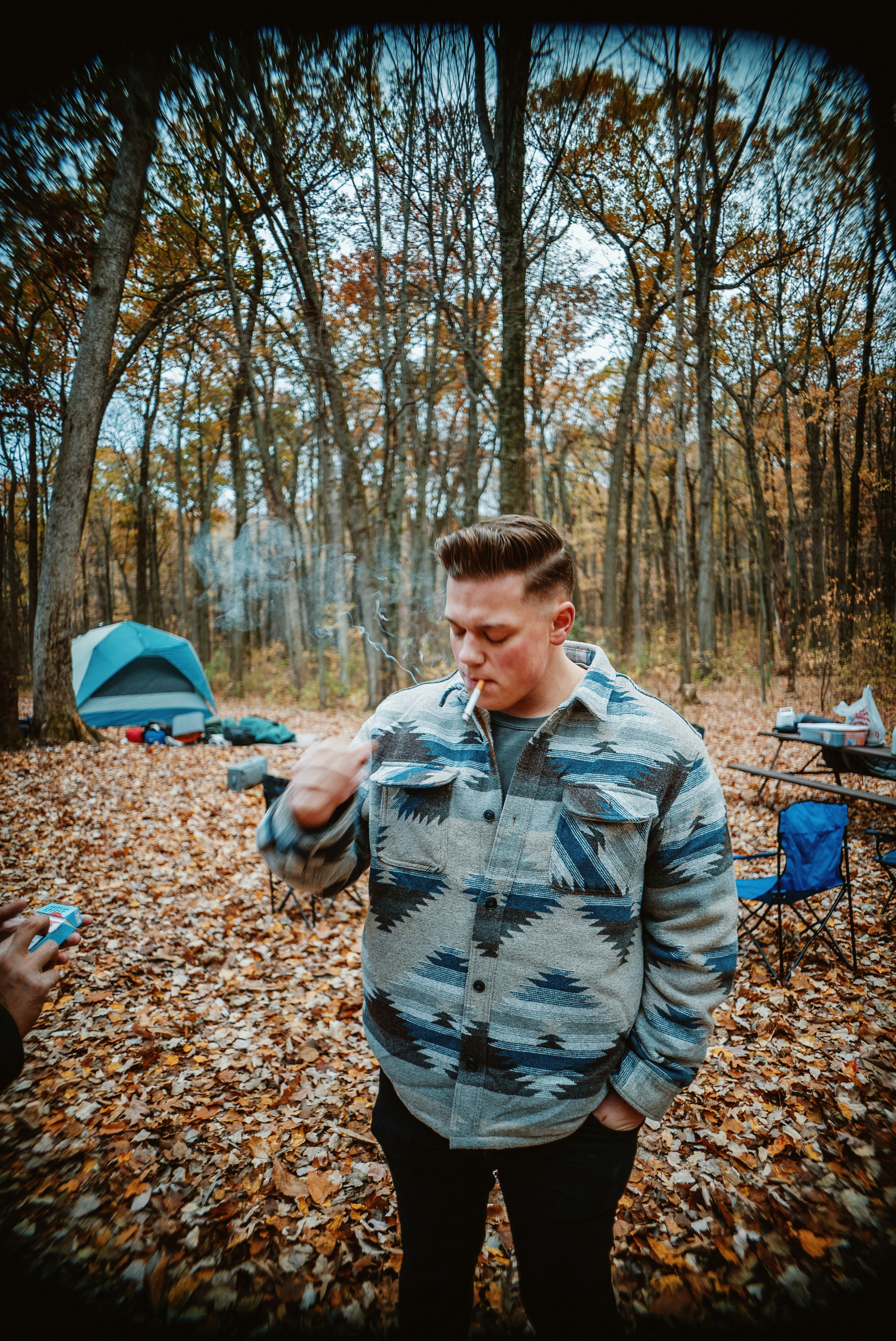 Autumn Camp Portrait: Smoke, Stripes, and Fallen Leaves