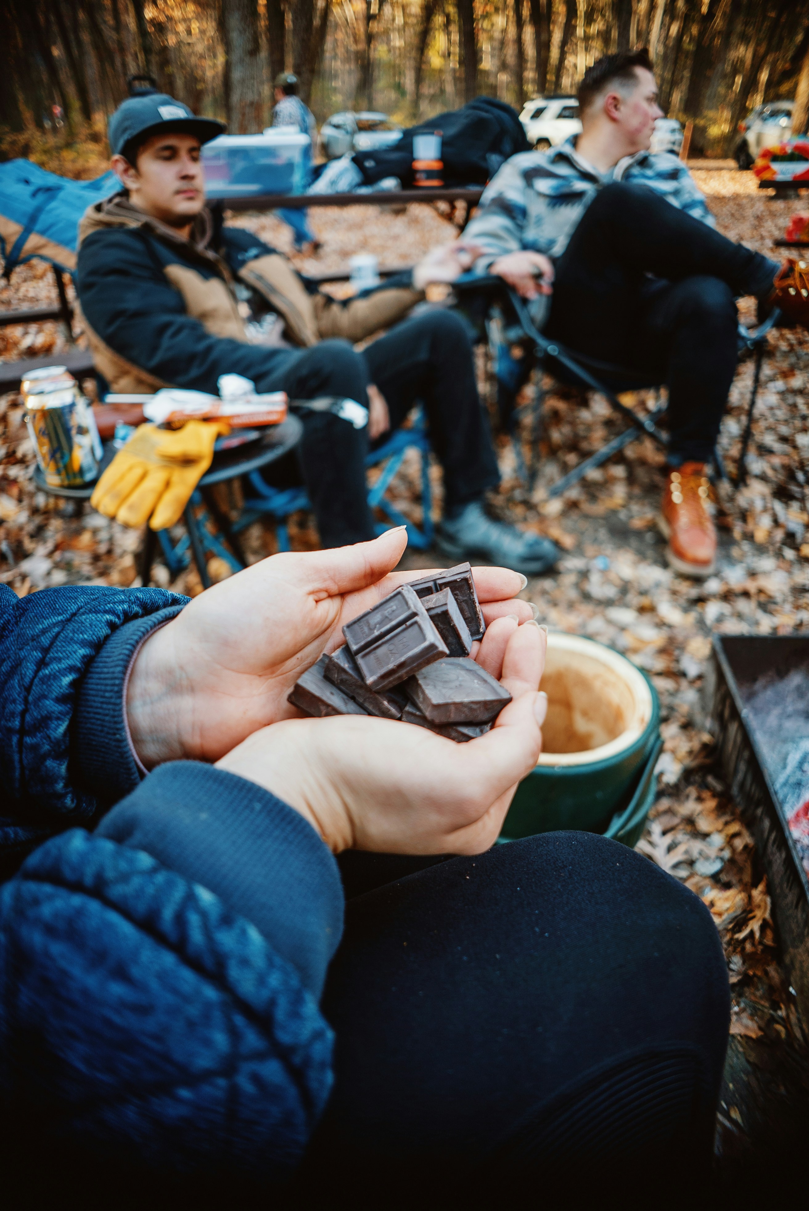 Chocolate in Hand, Friends in Frame: A Forest Camp Evening