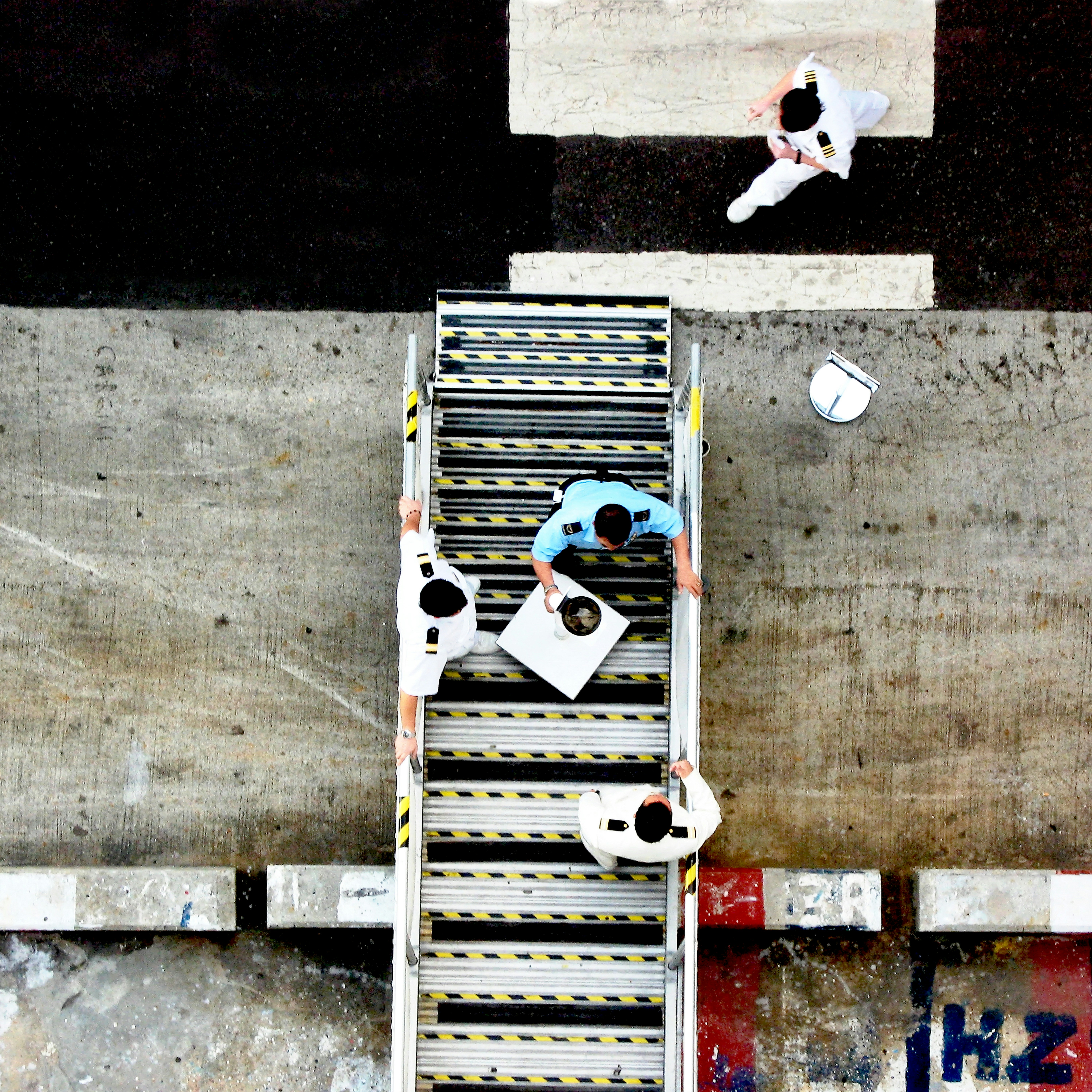 An overhead view of a man walking down a street photo – Free Overhead ...