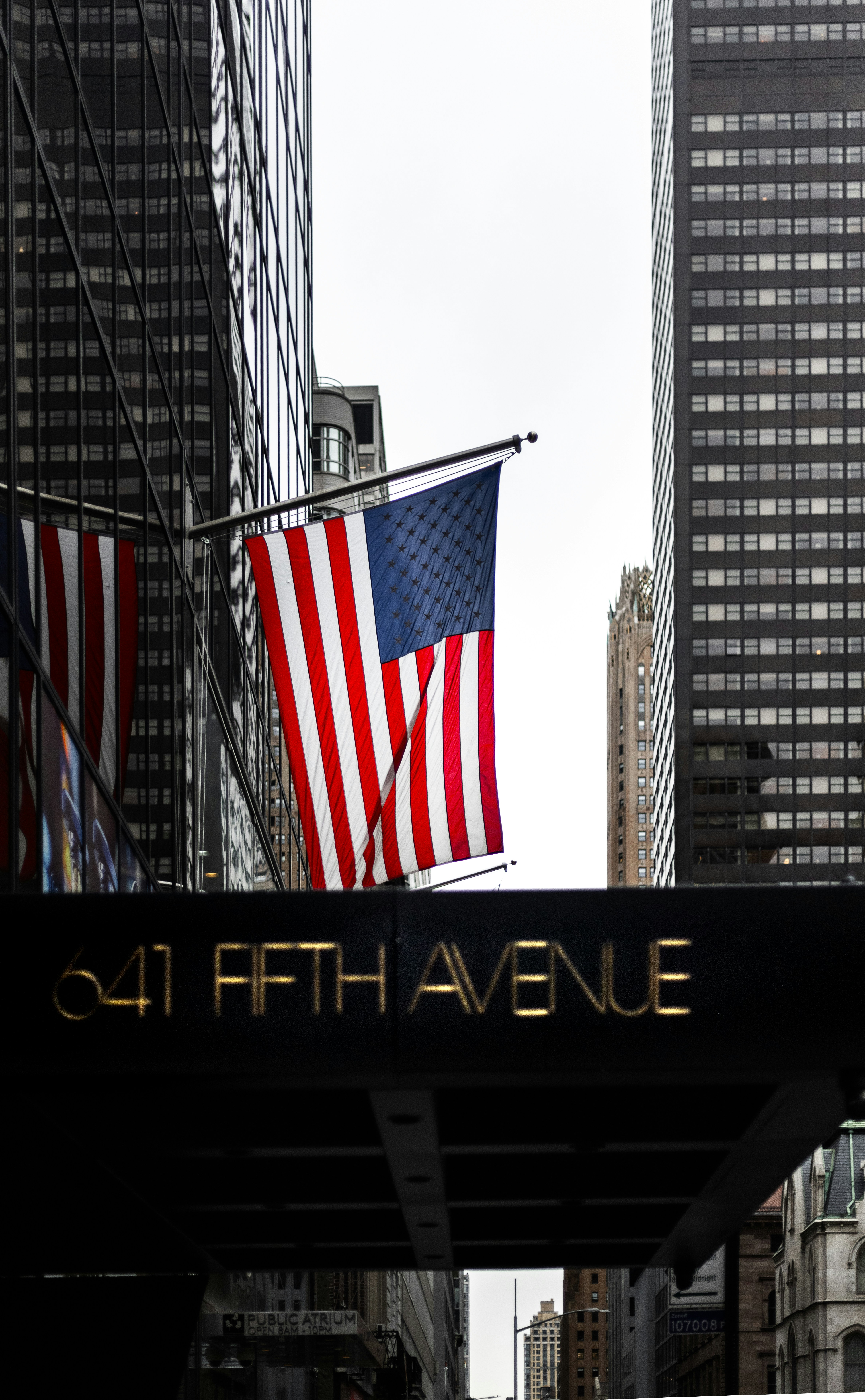 Flag Above Fifth Avenue: American Banner Between Giants