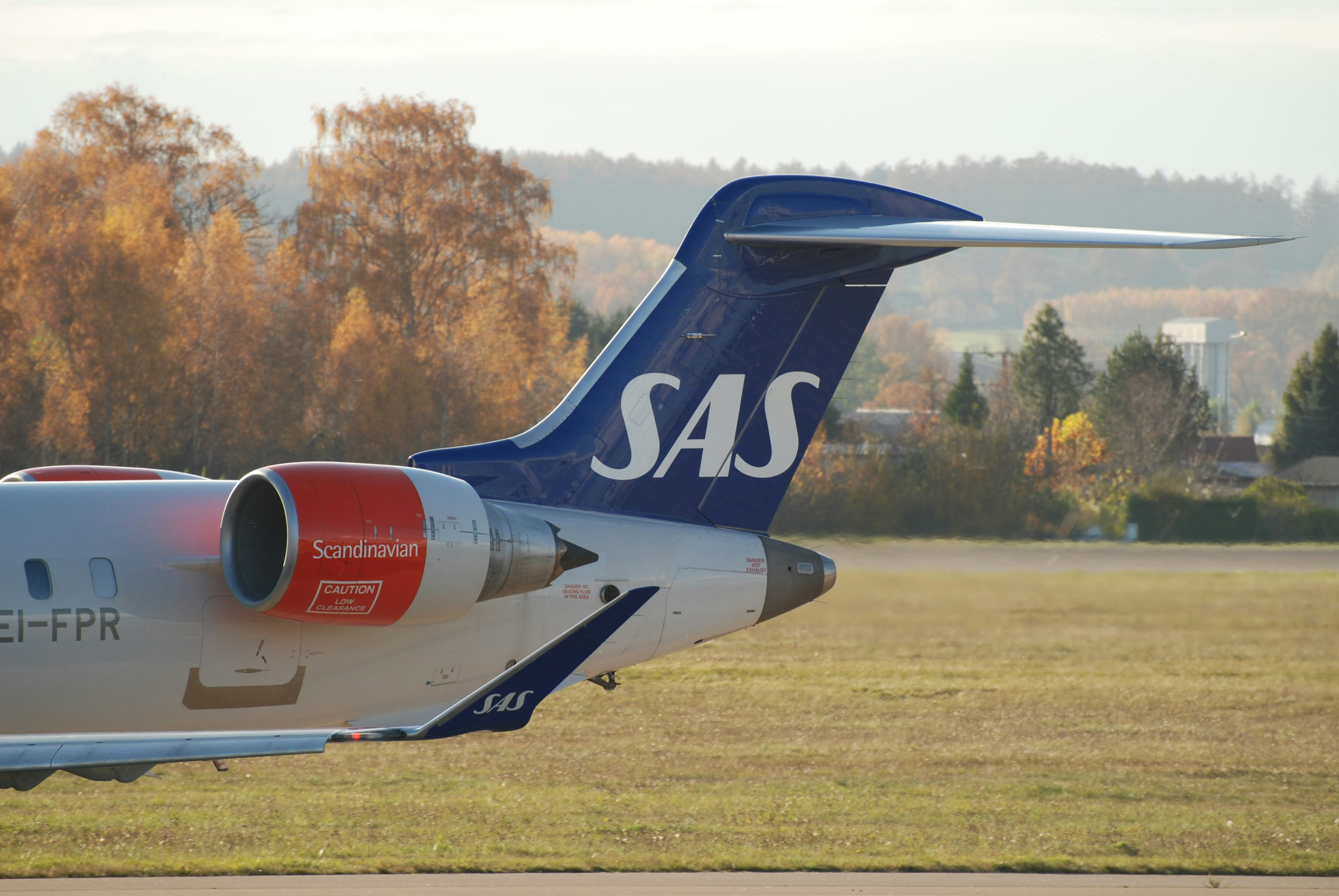 SAS Tailfin in Autumn Light: A Quiet Moment on the Runway