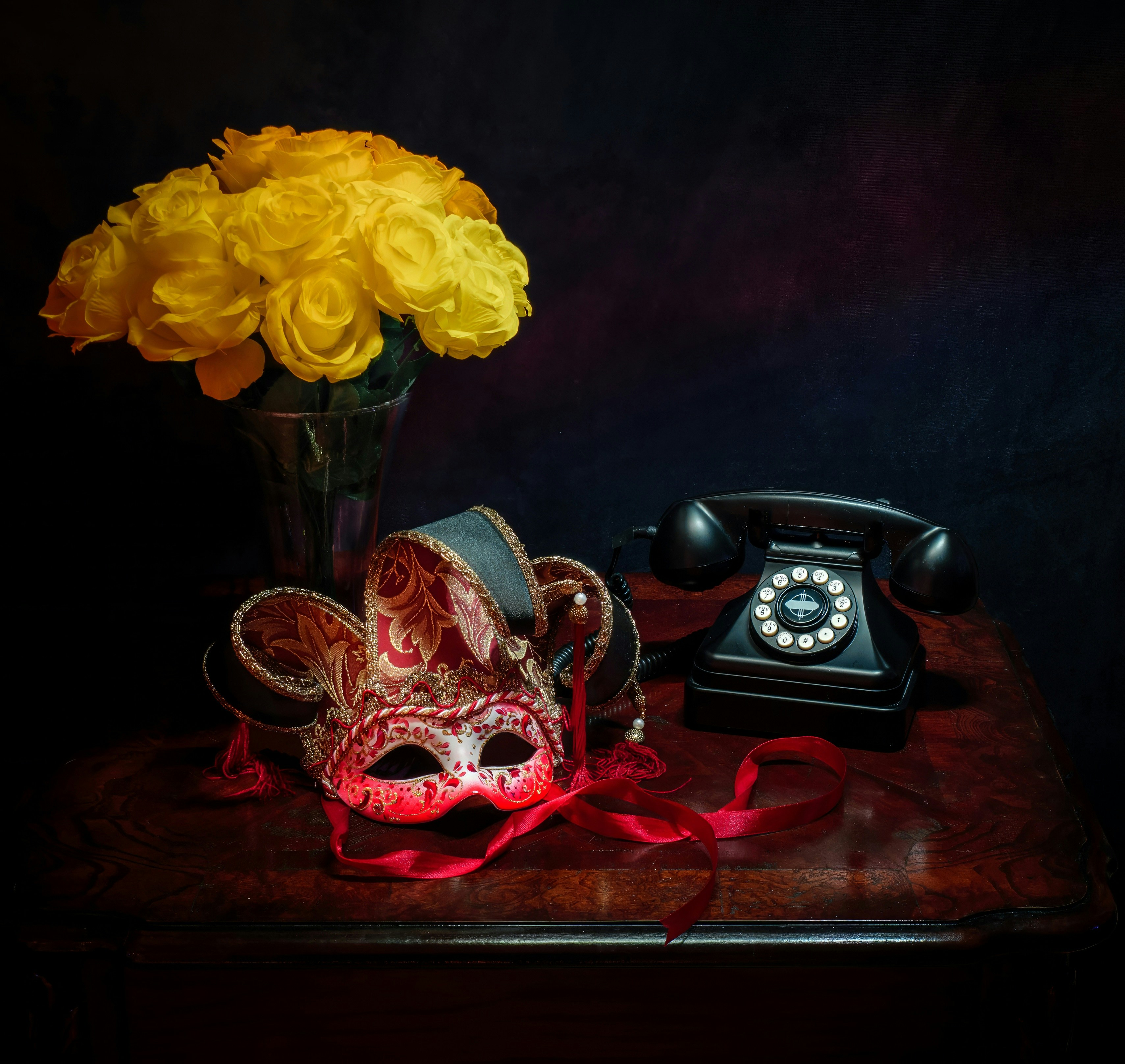 Velvet Mask Beside Yellow Roses and a Quiet Rotary Phone