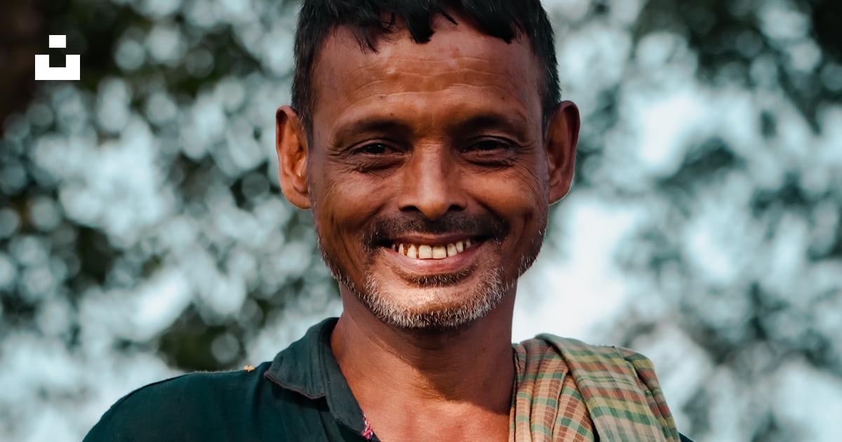 A Man With A Scarf Around His Neck Photo Free Human Image On Unsplash