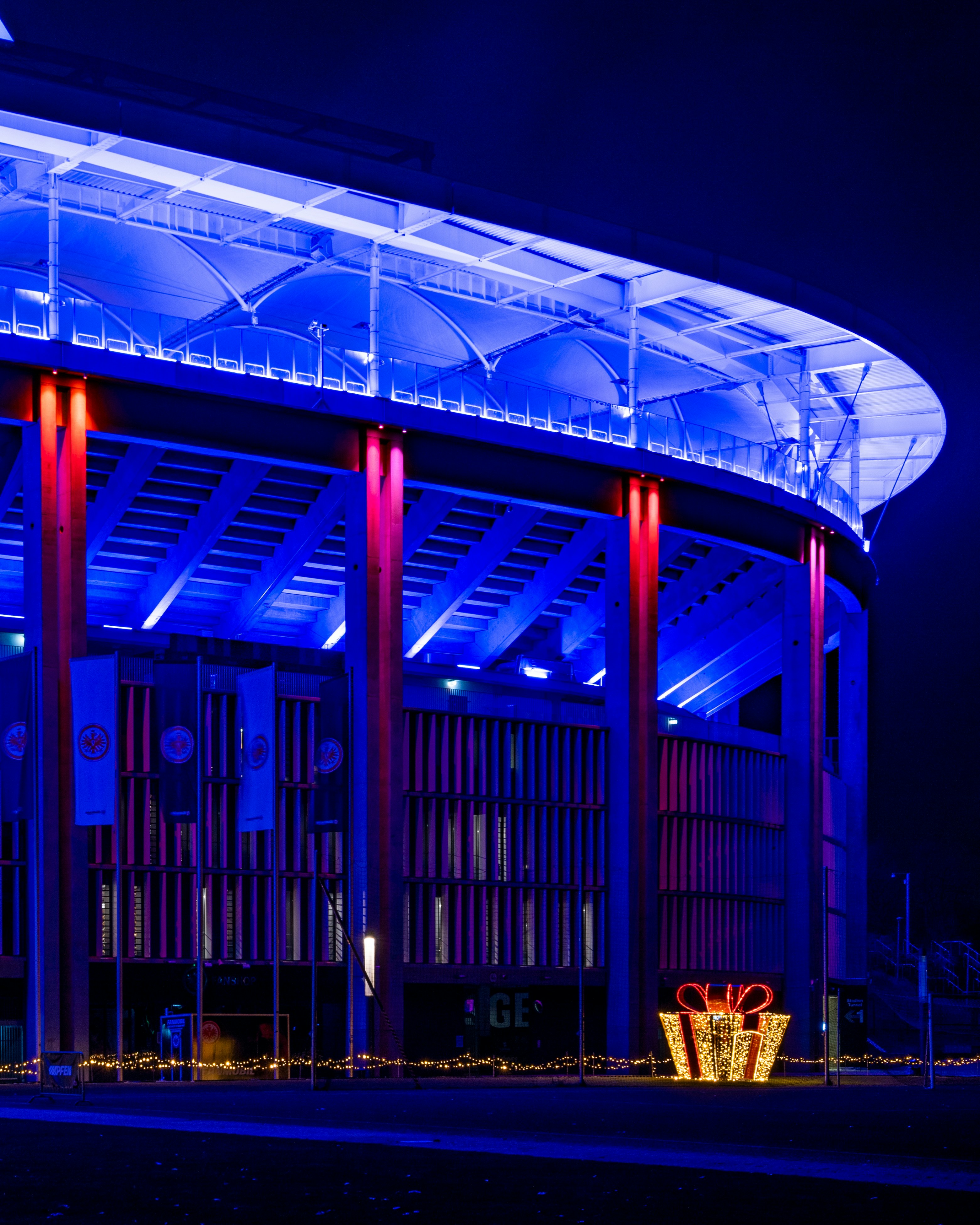 Blue Neon Arcades: Night Curve and a Festive Glow