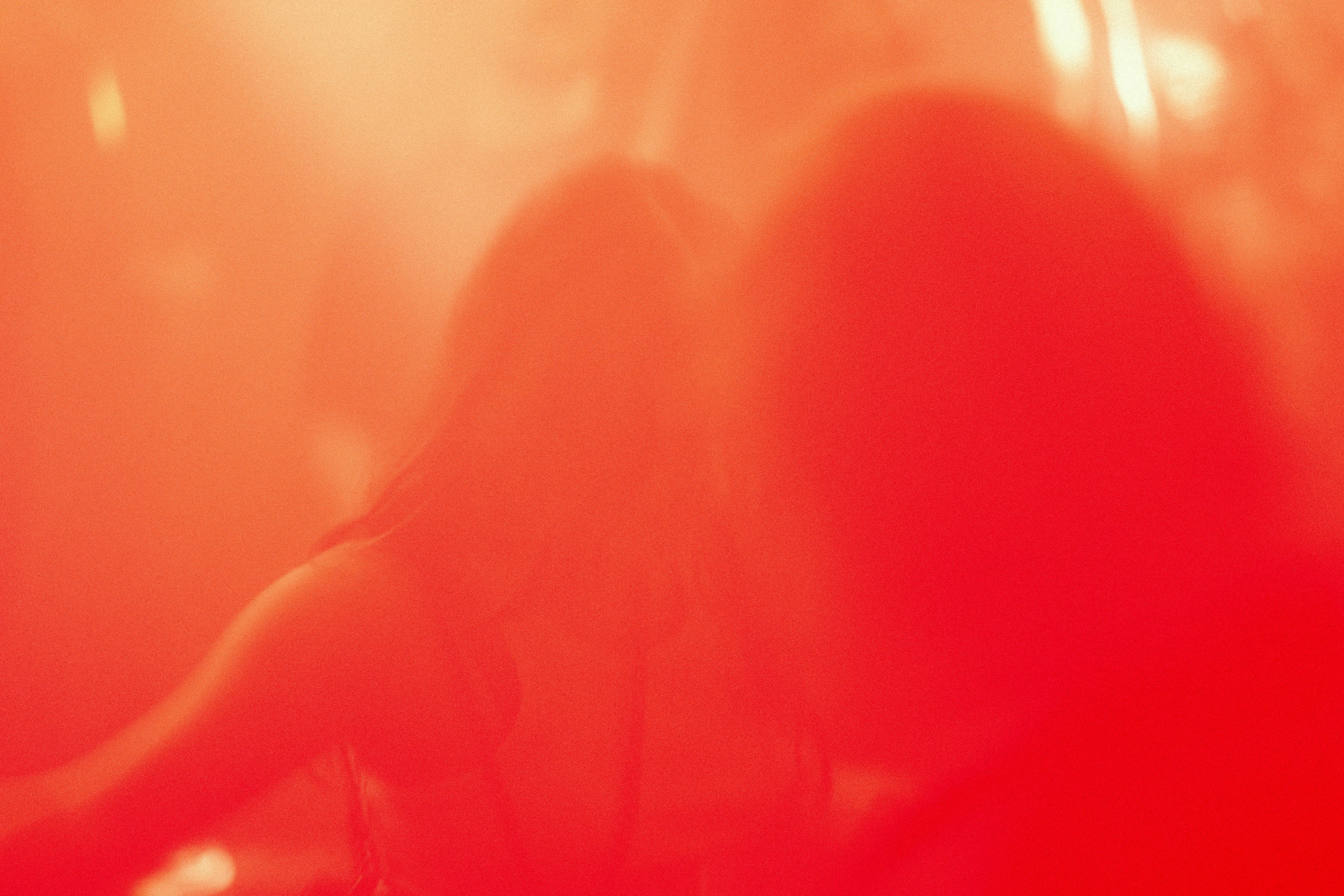A woman standing in front of a red light photo – Free France Image on ...