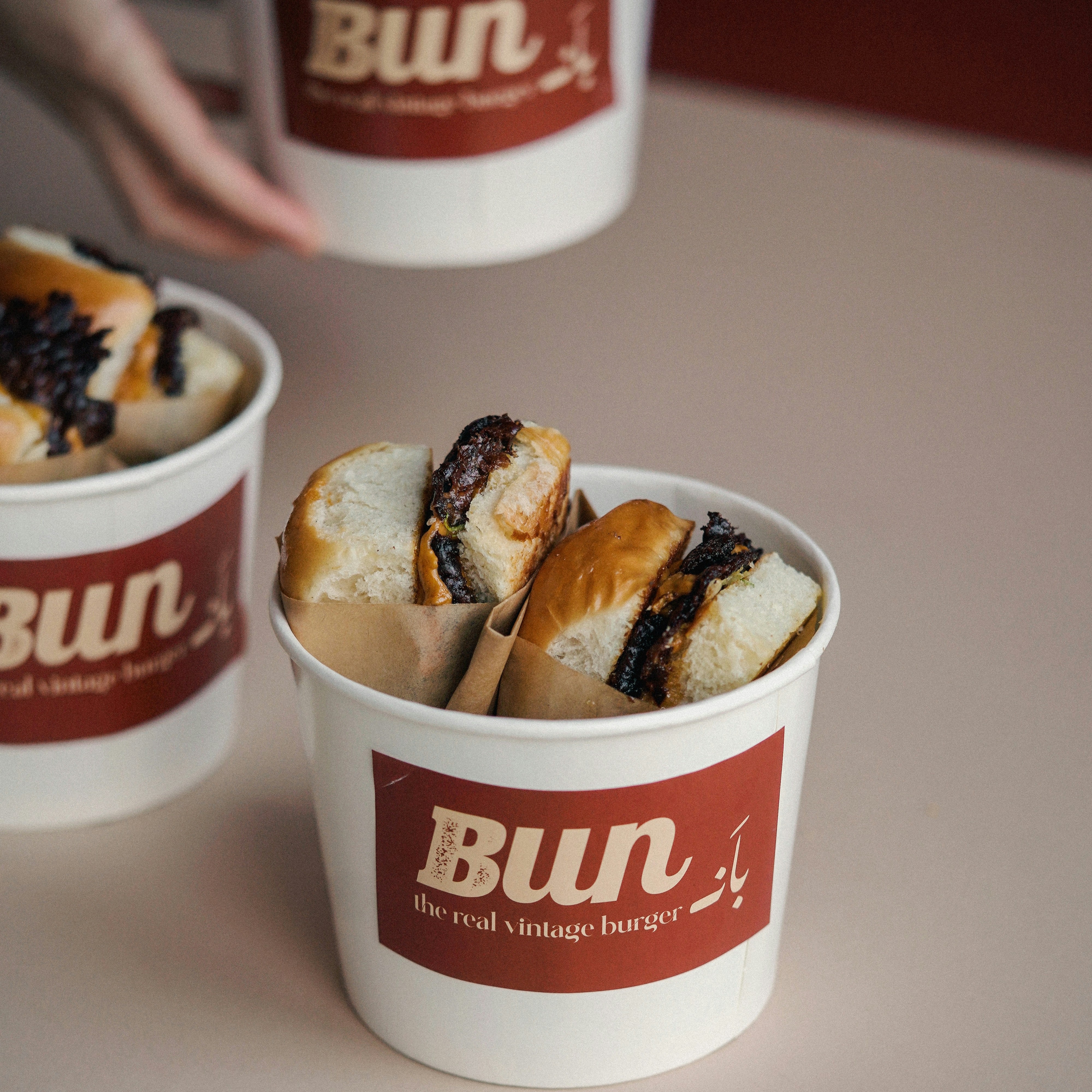 Two buns in a cup with bun wrappers in them photo – Free Food Image on ...