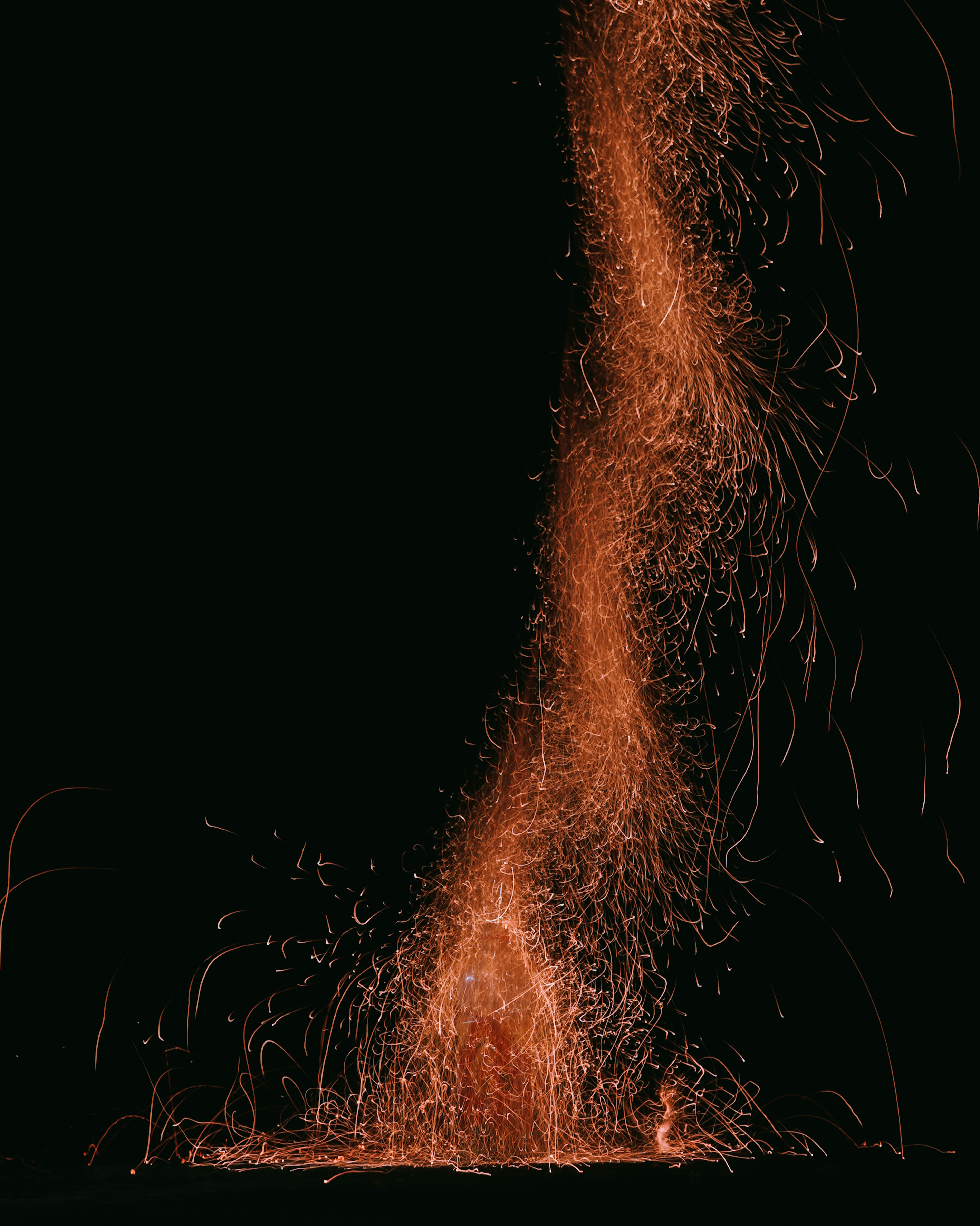 A fire hydrant spewing out of the ground at night photo – Free Festival ...