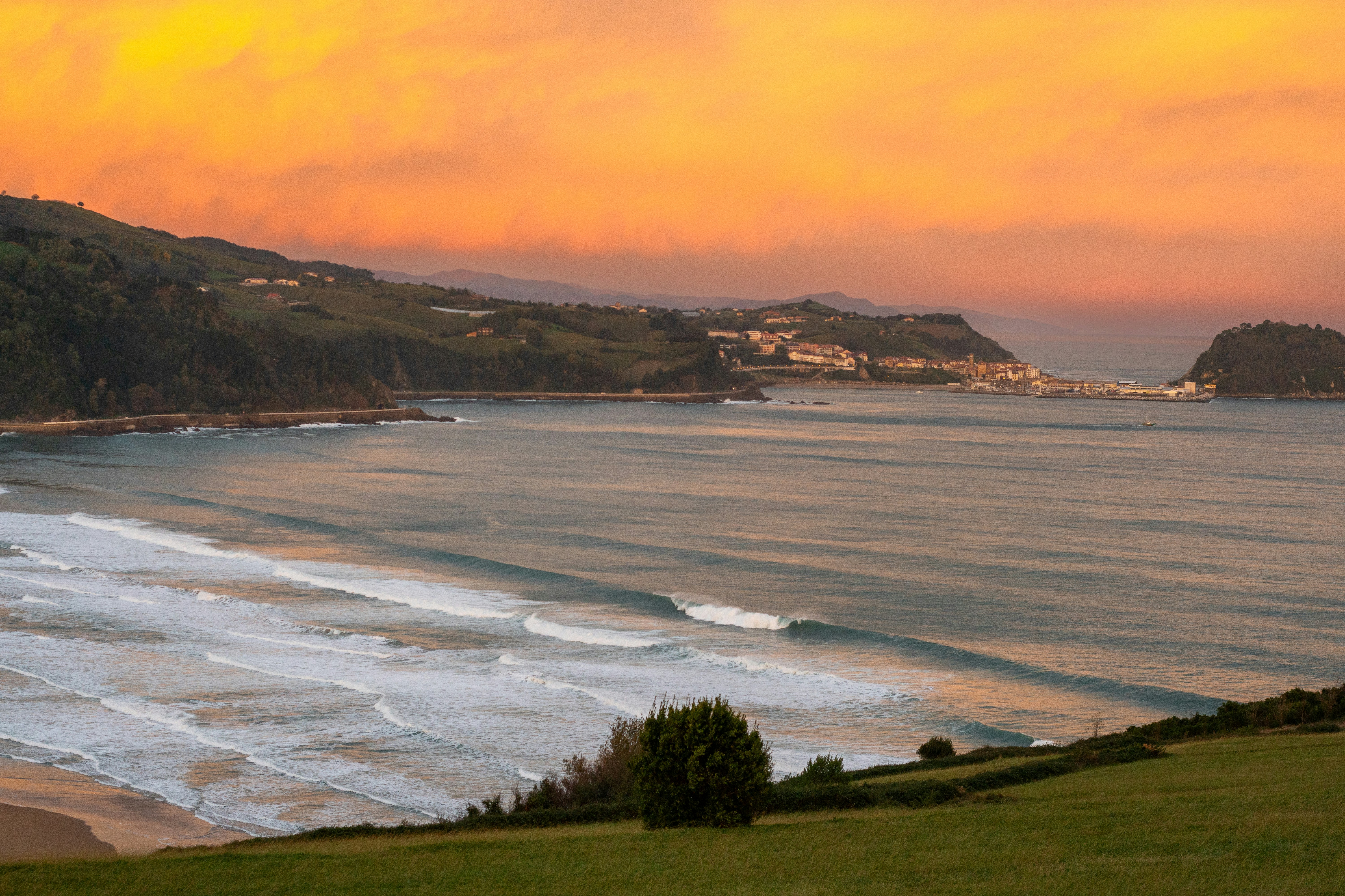 Golden Hour Coastal Panorama Over Quiet Waves