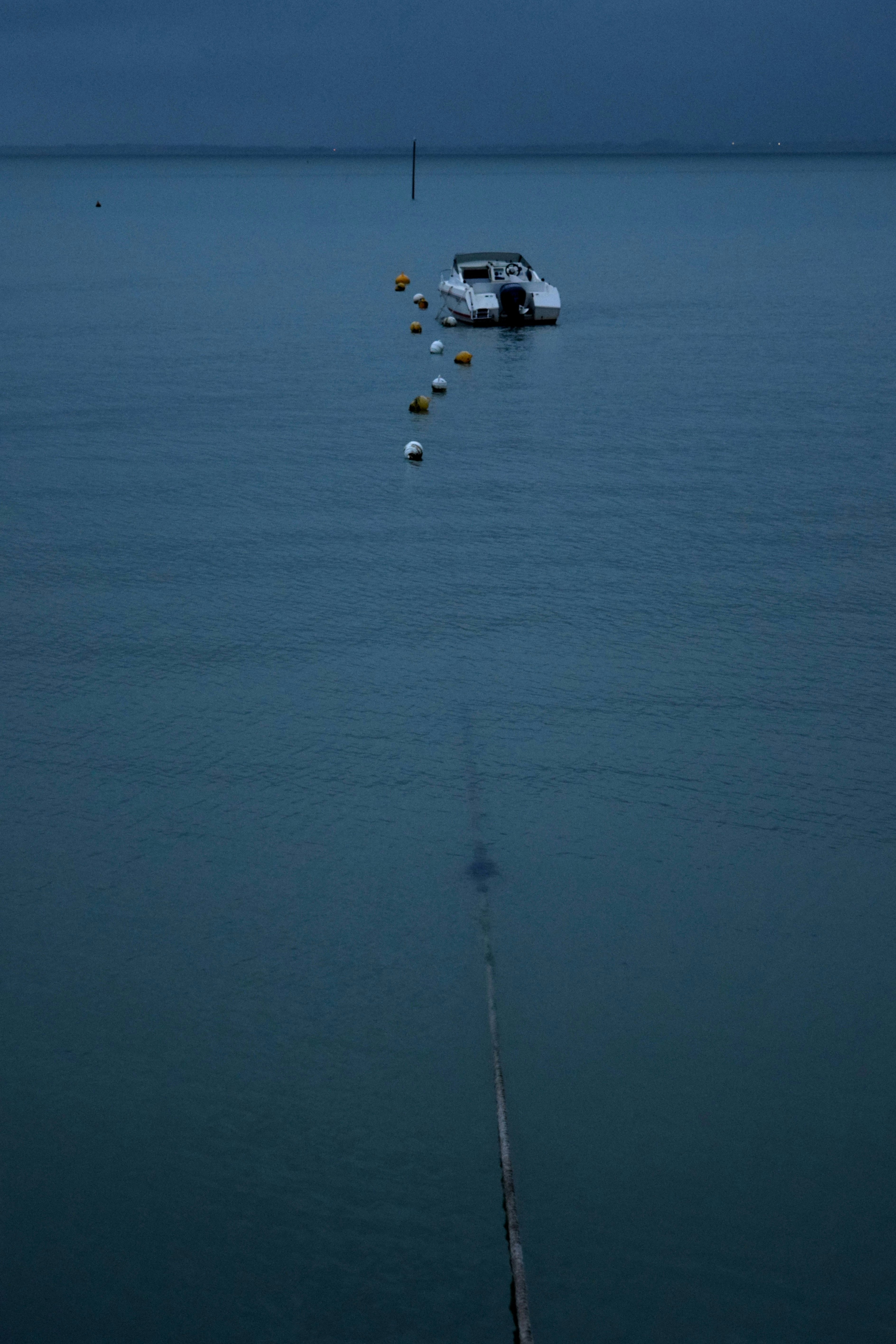A boat floating on top of a large body of water photo – Free Sea Image ...
