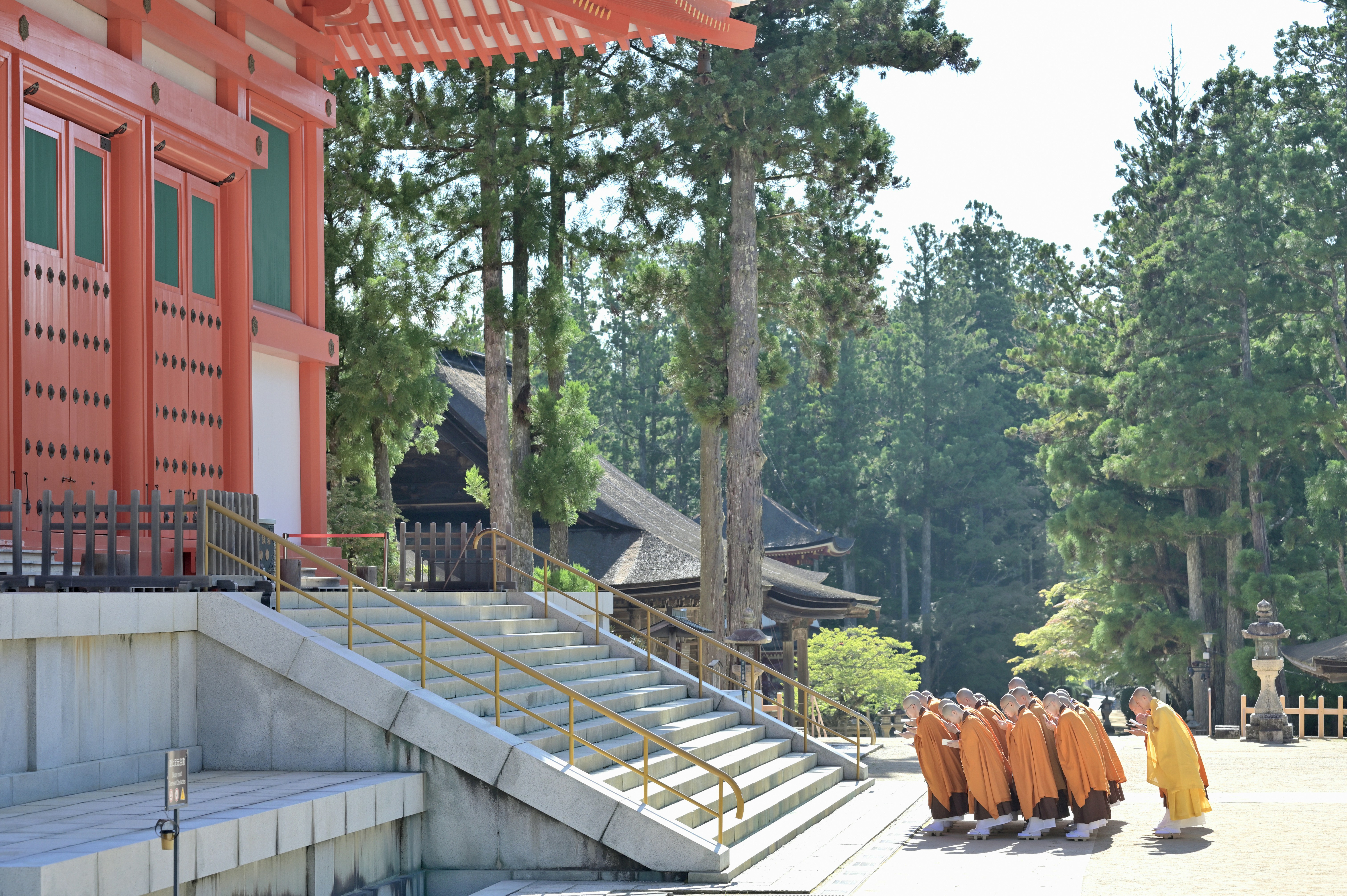 Saffron Steps: Monks at the Red Temple Courtyard