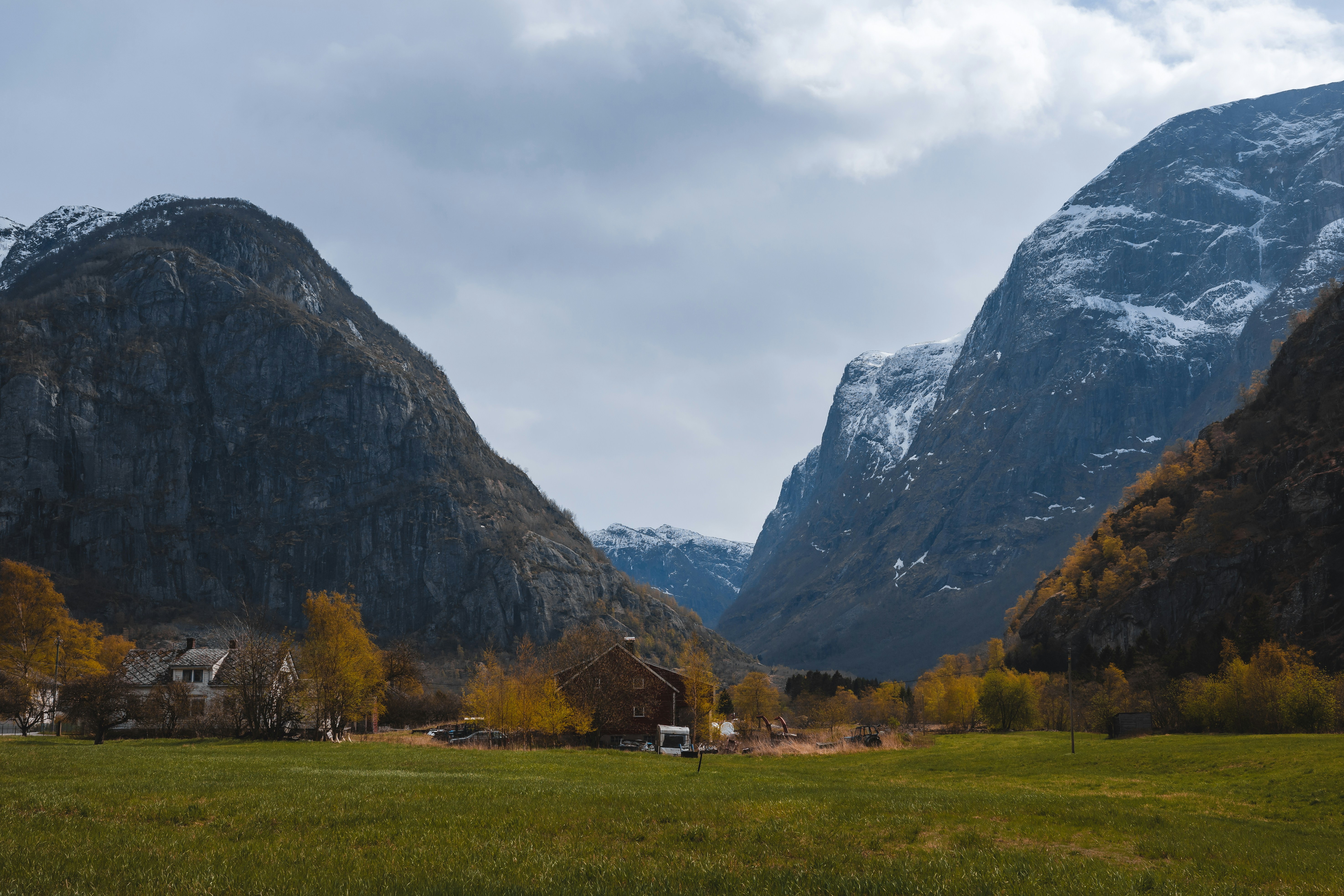 Quiet Valley Beneath Snow-Kissed Peaks