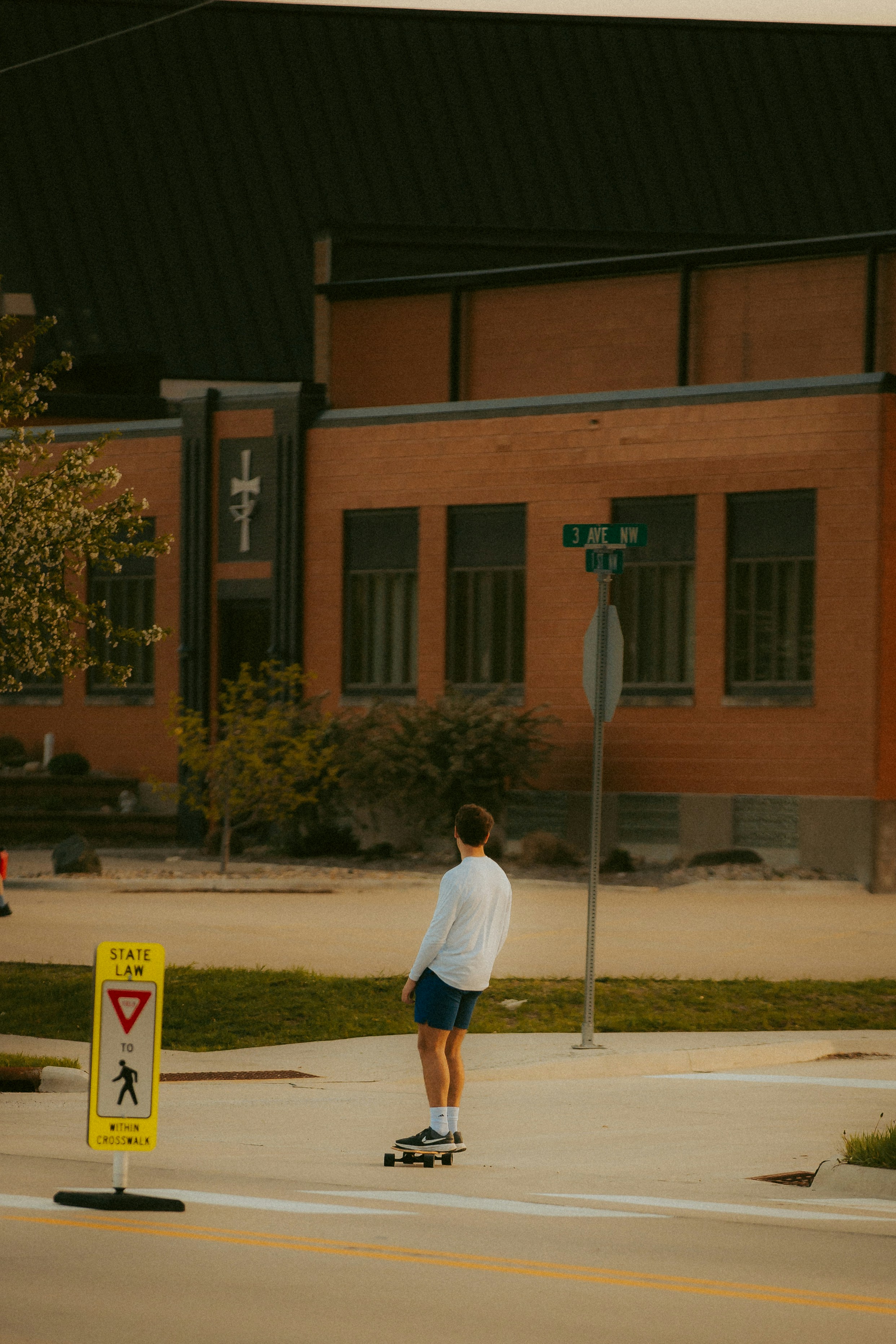 Skateboarder at the Corner: Quiet Street, Quiet Moment