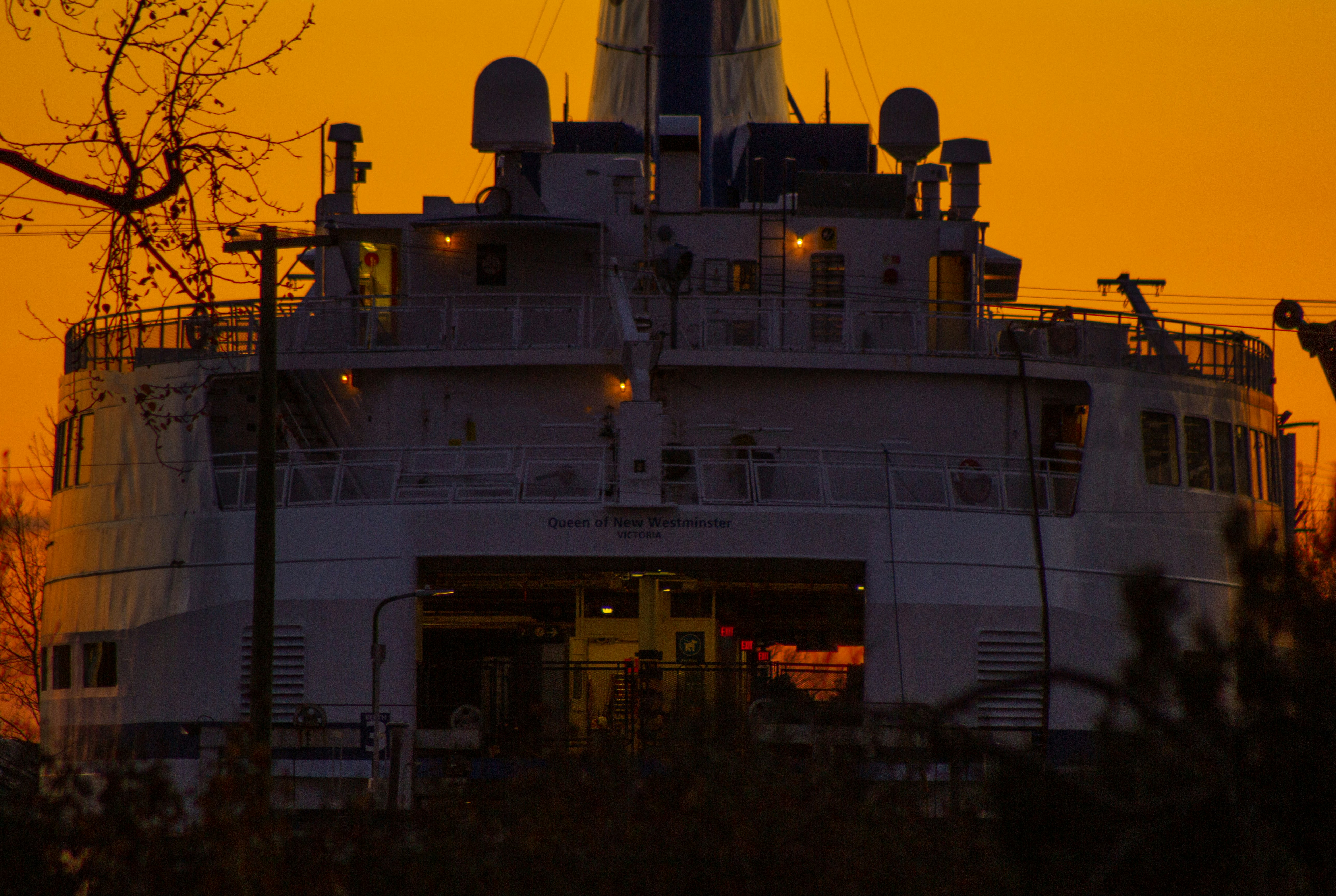 Orange Hour on a Quiet Vessel: The Silhouette of a Ship