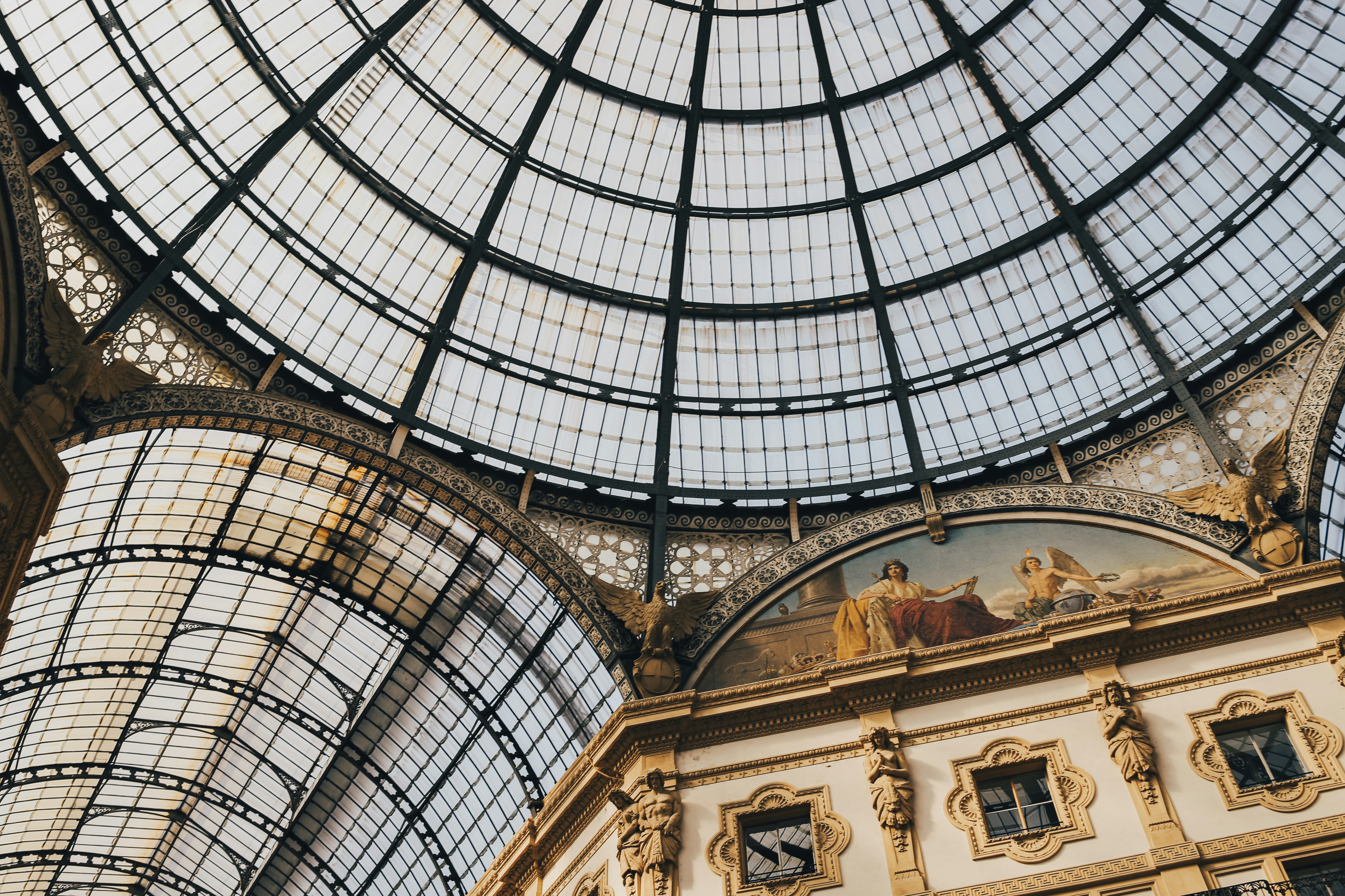 Crisscrossed Light Over a Glass-Domed Baroque Atrium