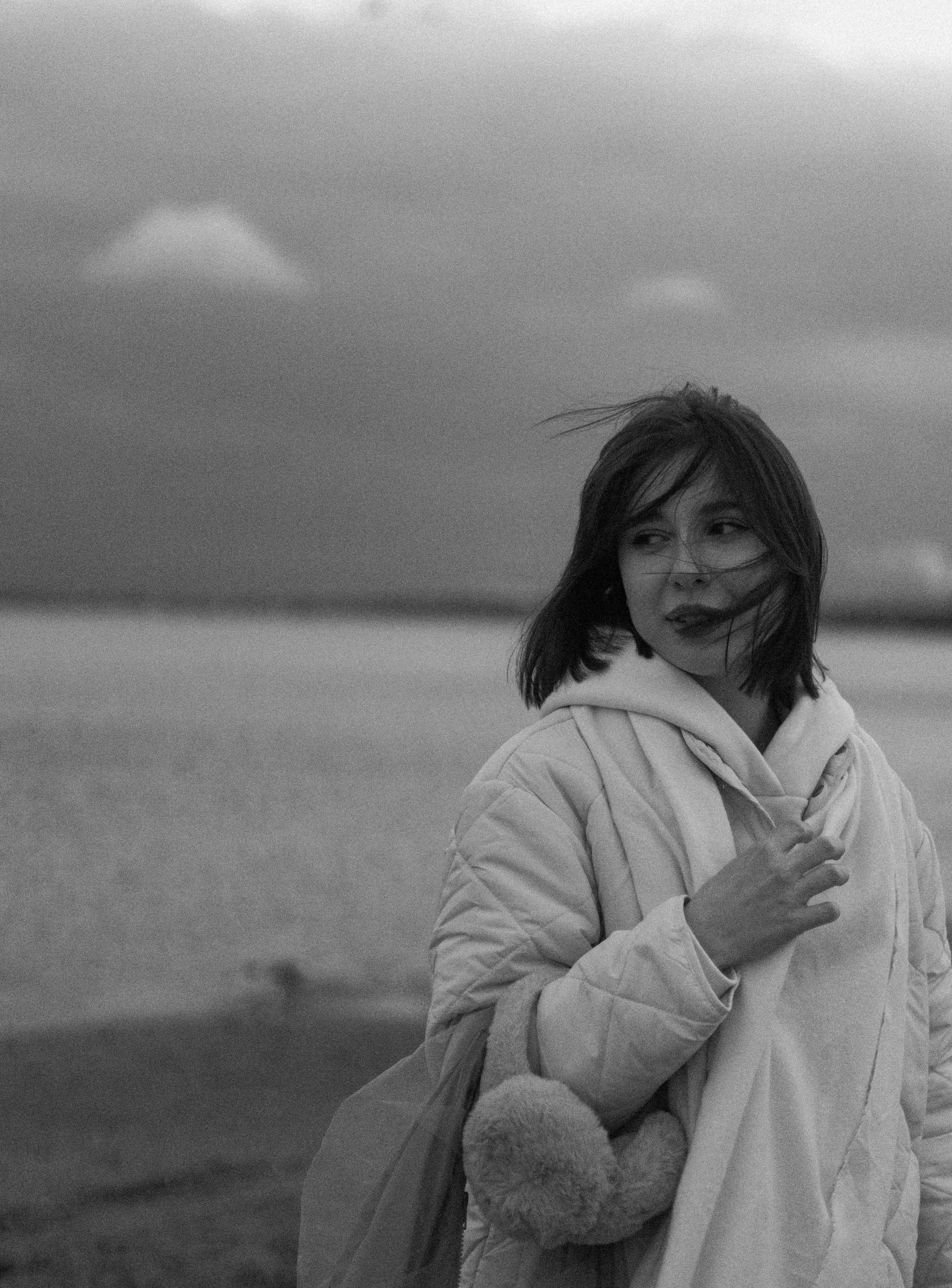 Gray Hour on the Shore: A Wind-Curled Portrait