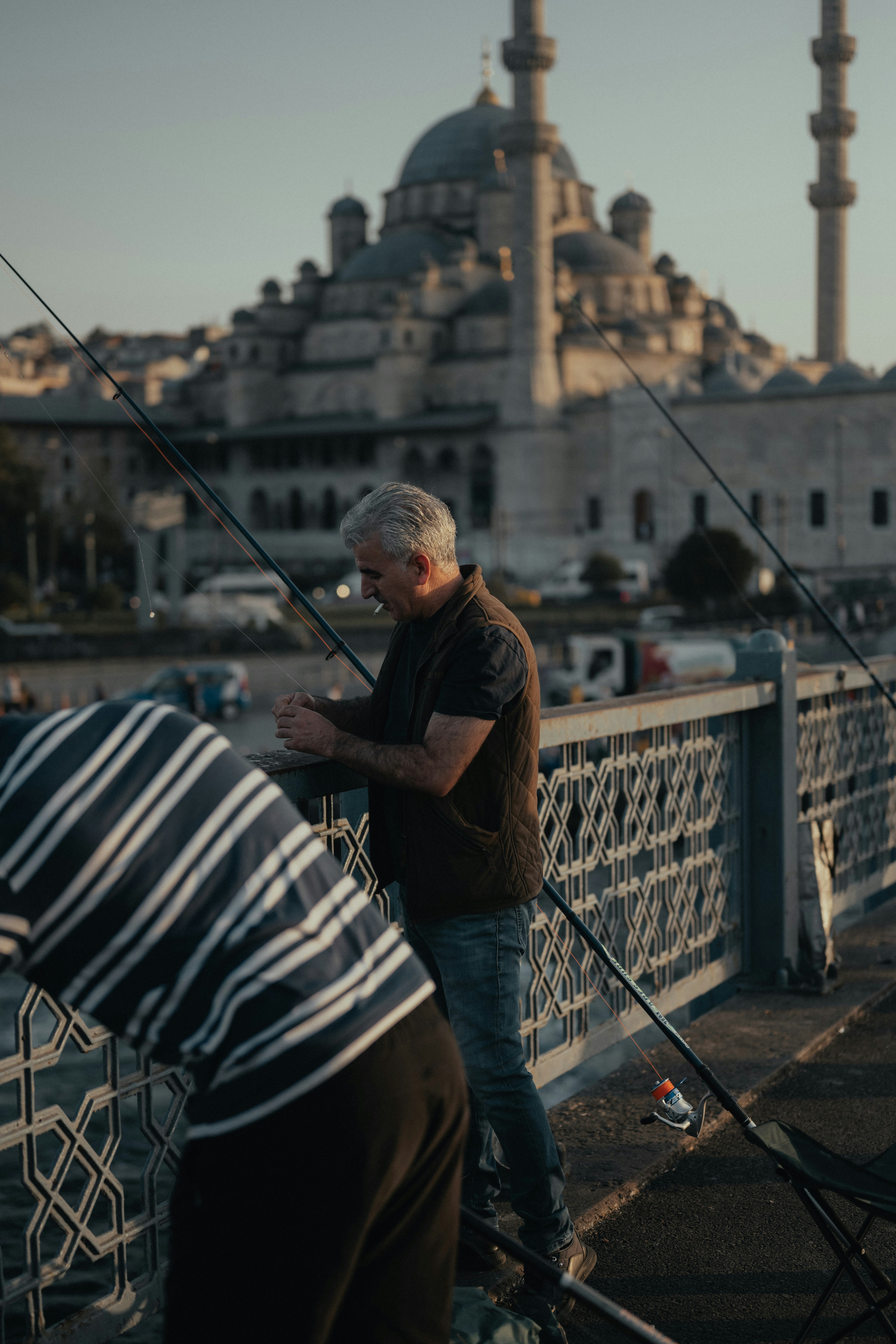 On the Edge of Golden Horn: A man in contemplation under Istanbul’s domed skyline