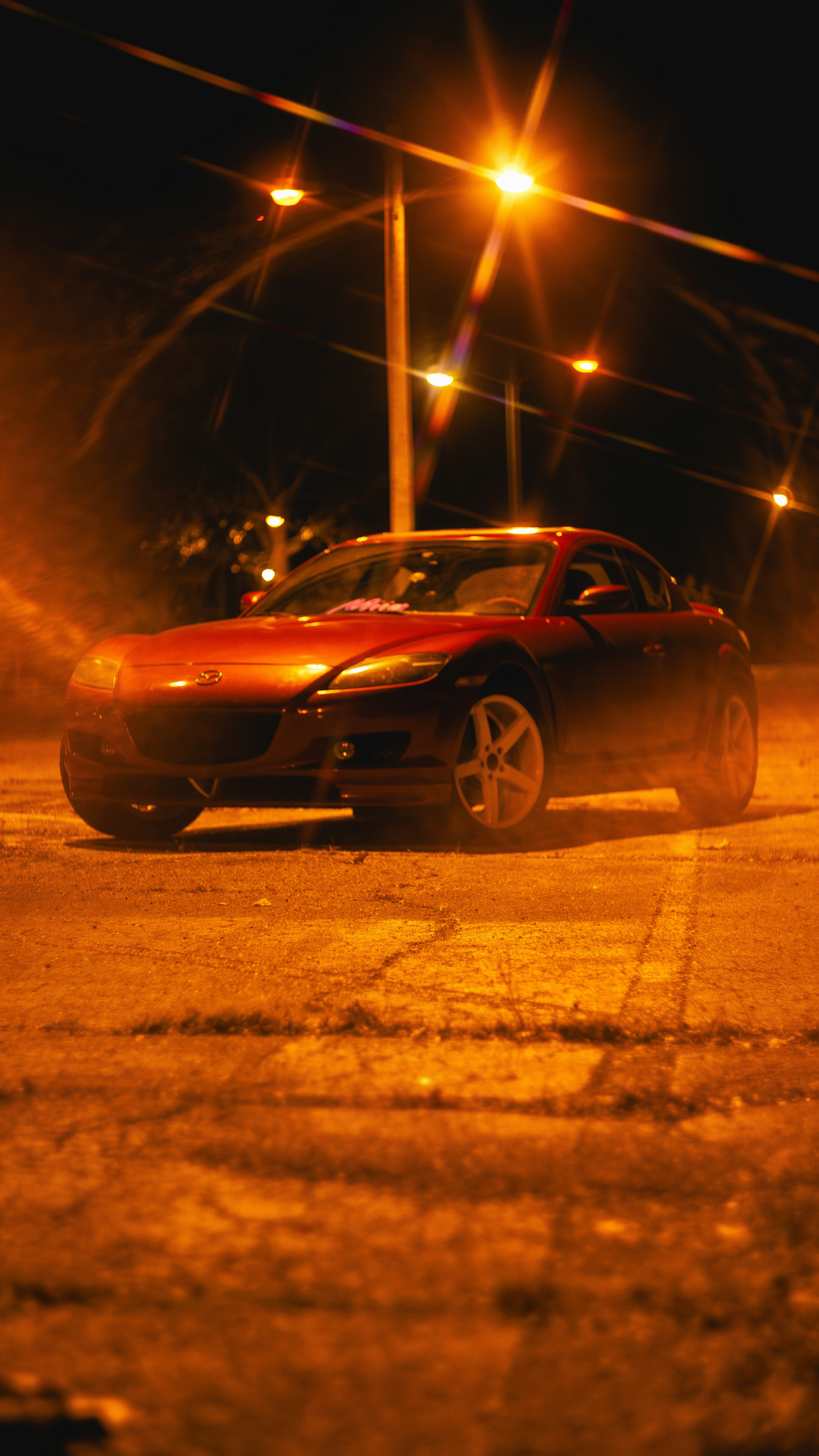 Orange Night Mustang Under Streetlight Glares