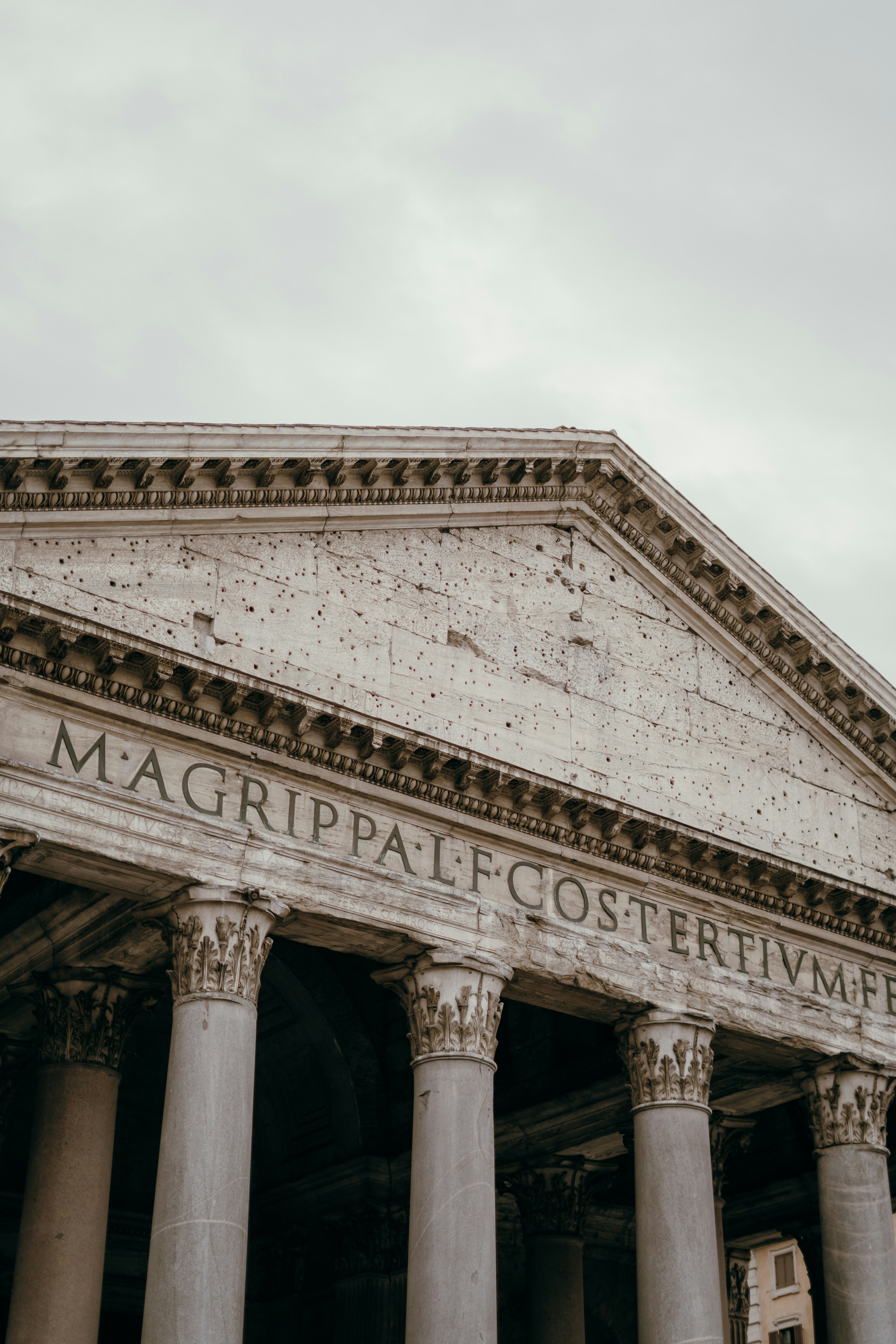 Centuries-etched Pediment: The Pantheon's Quiet Gaze Under a Gray Sky