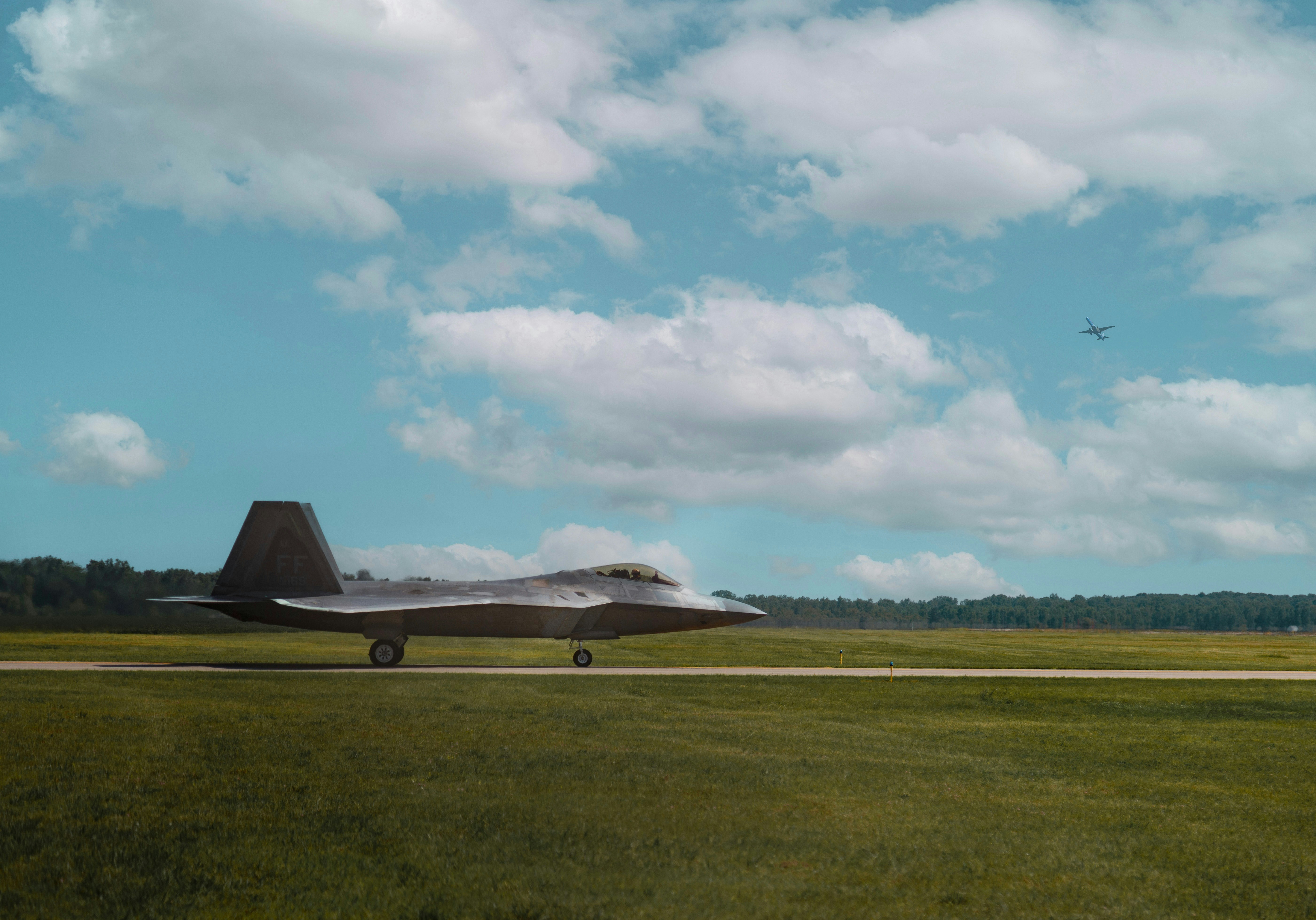 A fighter jet sitting on top of an airport runway photo – Free Airshow ...