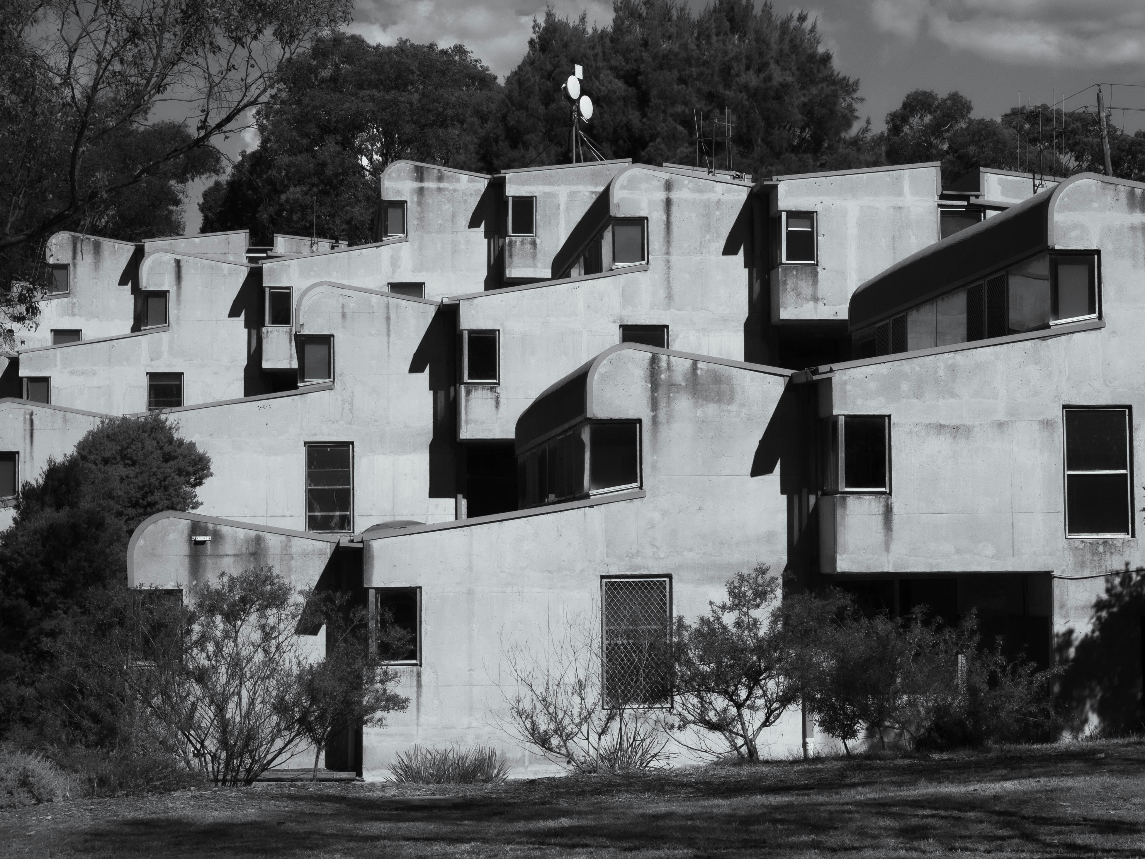 Concrete Mosaic: A labyrinth of stacked apartments in grayscale