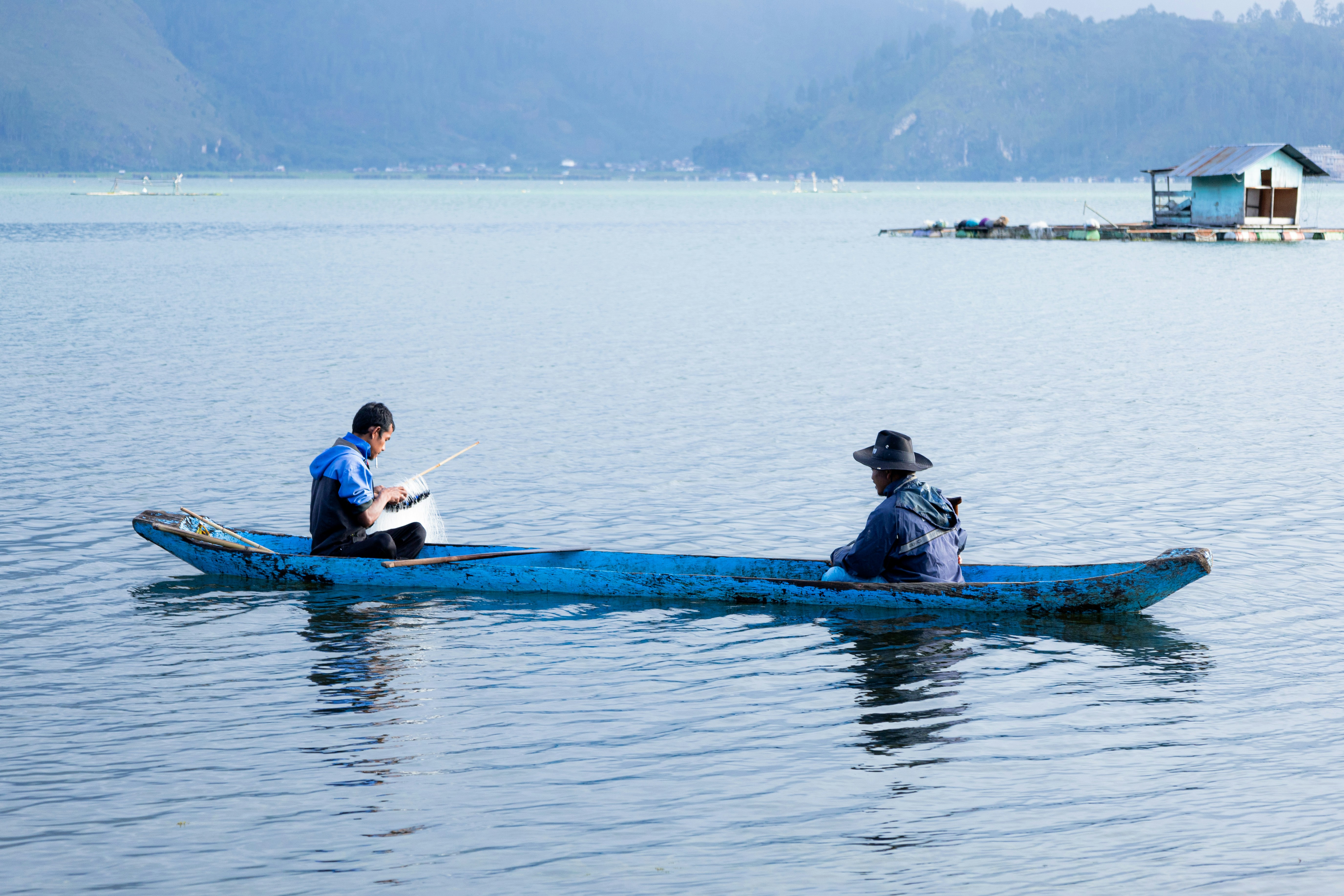 Blue Skiff on a Tranquil Lake: A Quiet Reading Moment