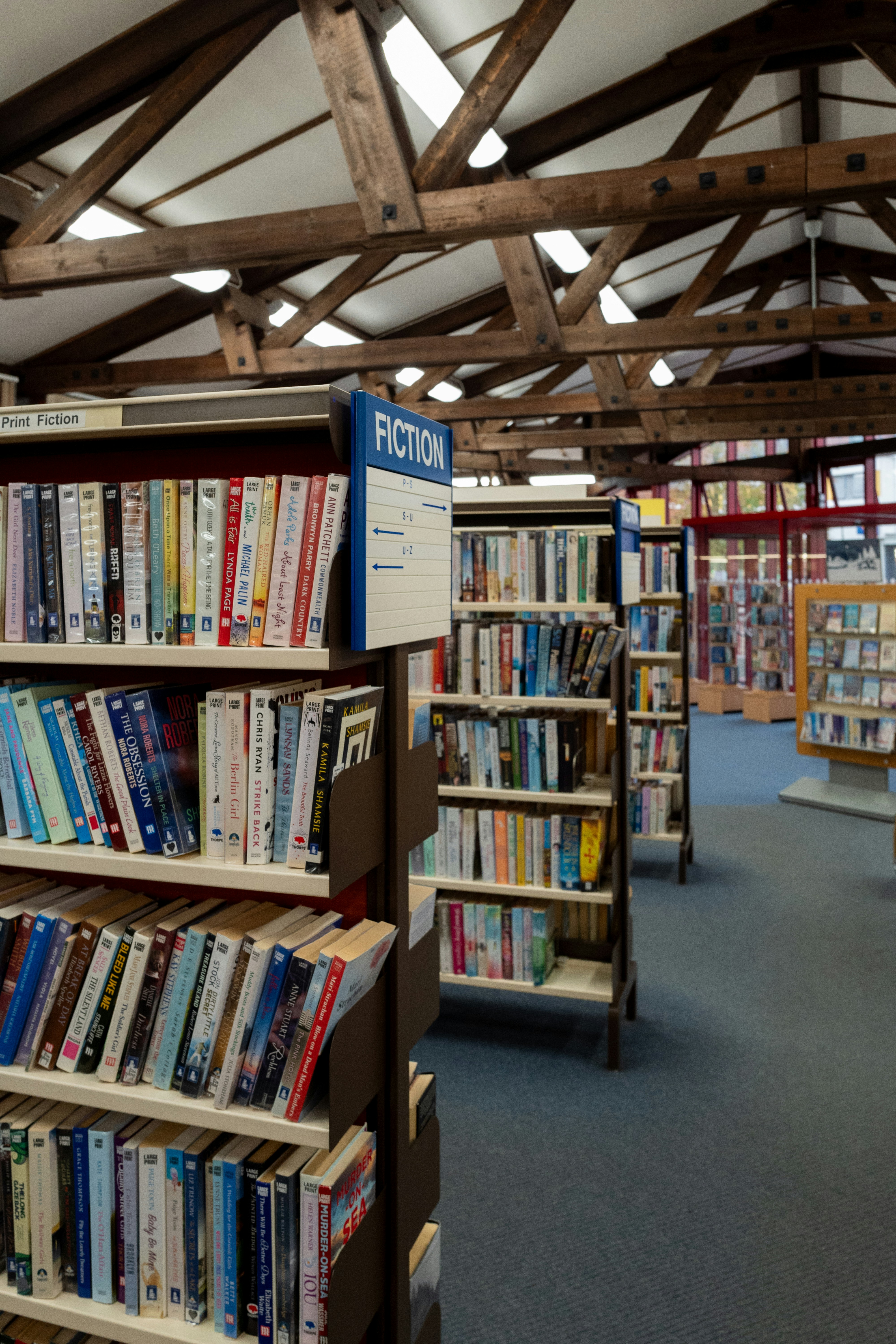 A row of shelves filled with lots of books photo – Free Woodley Image ...