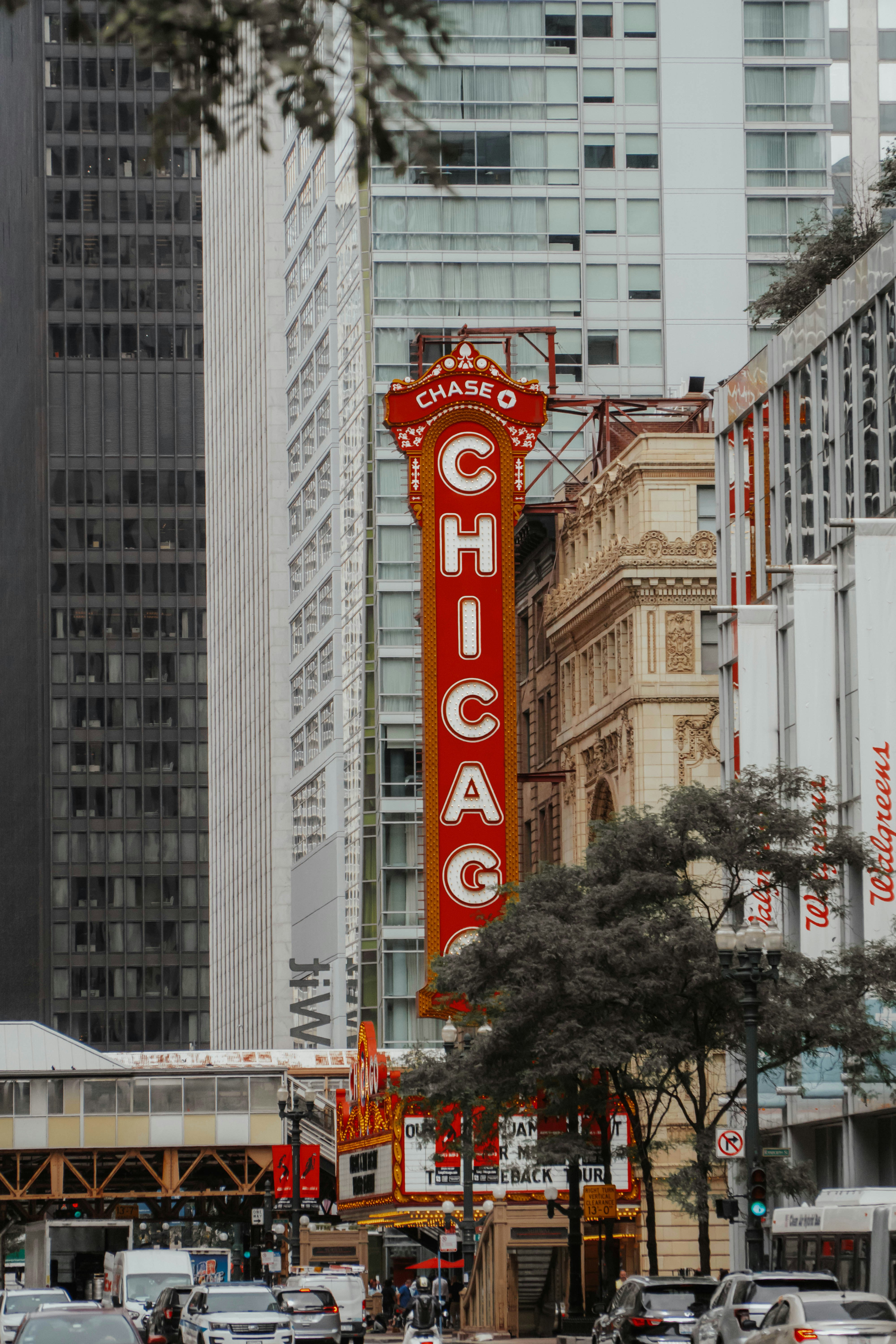 A red chicago sign hanging from the side of a building photo – Free ...