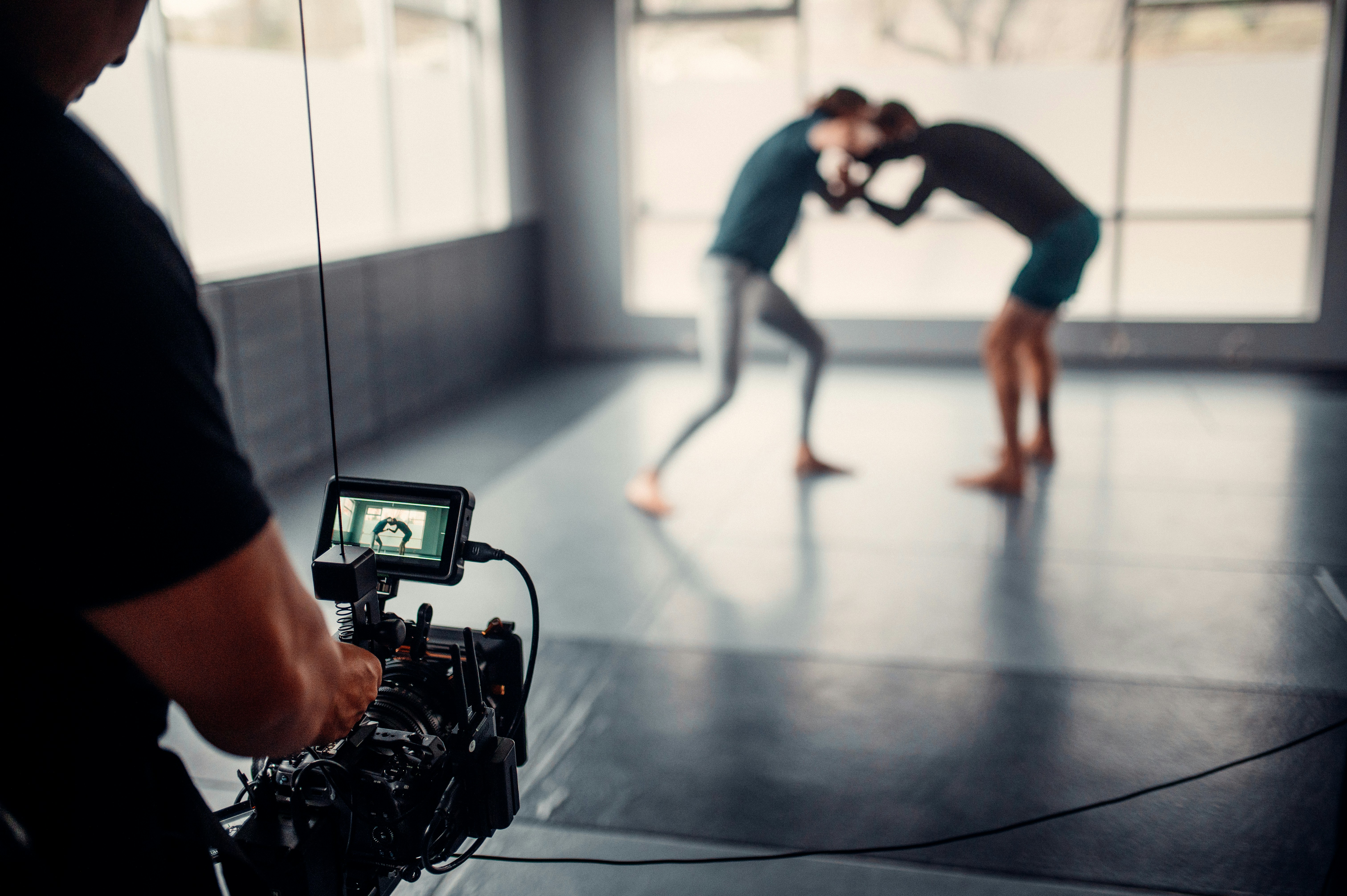 A man is filming a woman in a dance studio photo – Free Photo Image on ...