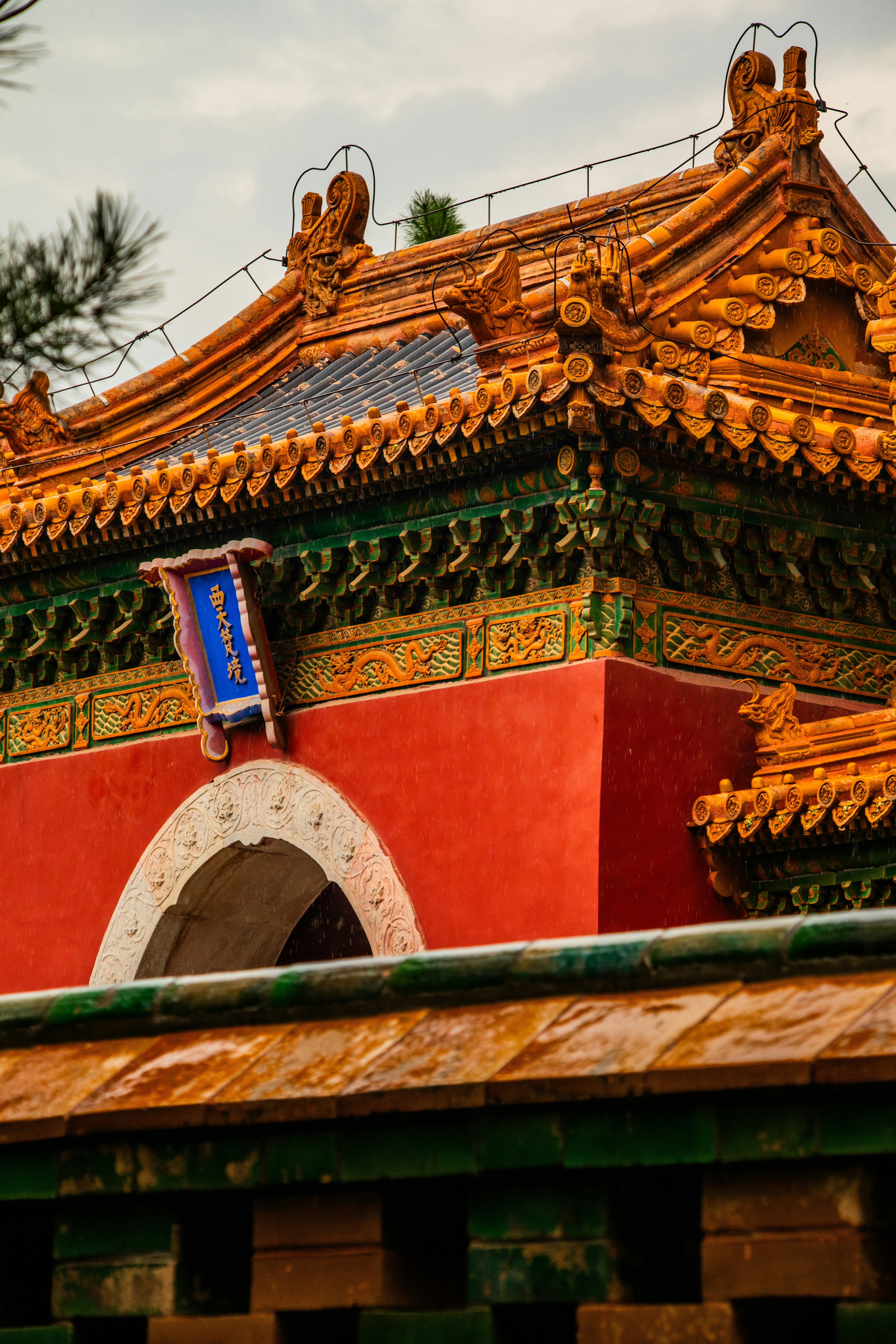 Amber Tiles and Dragon Crest: Close-Up of a Chinese Temple Roof