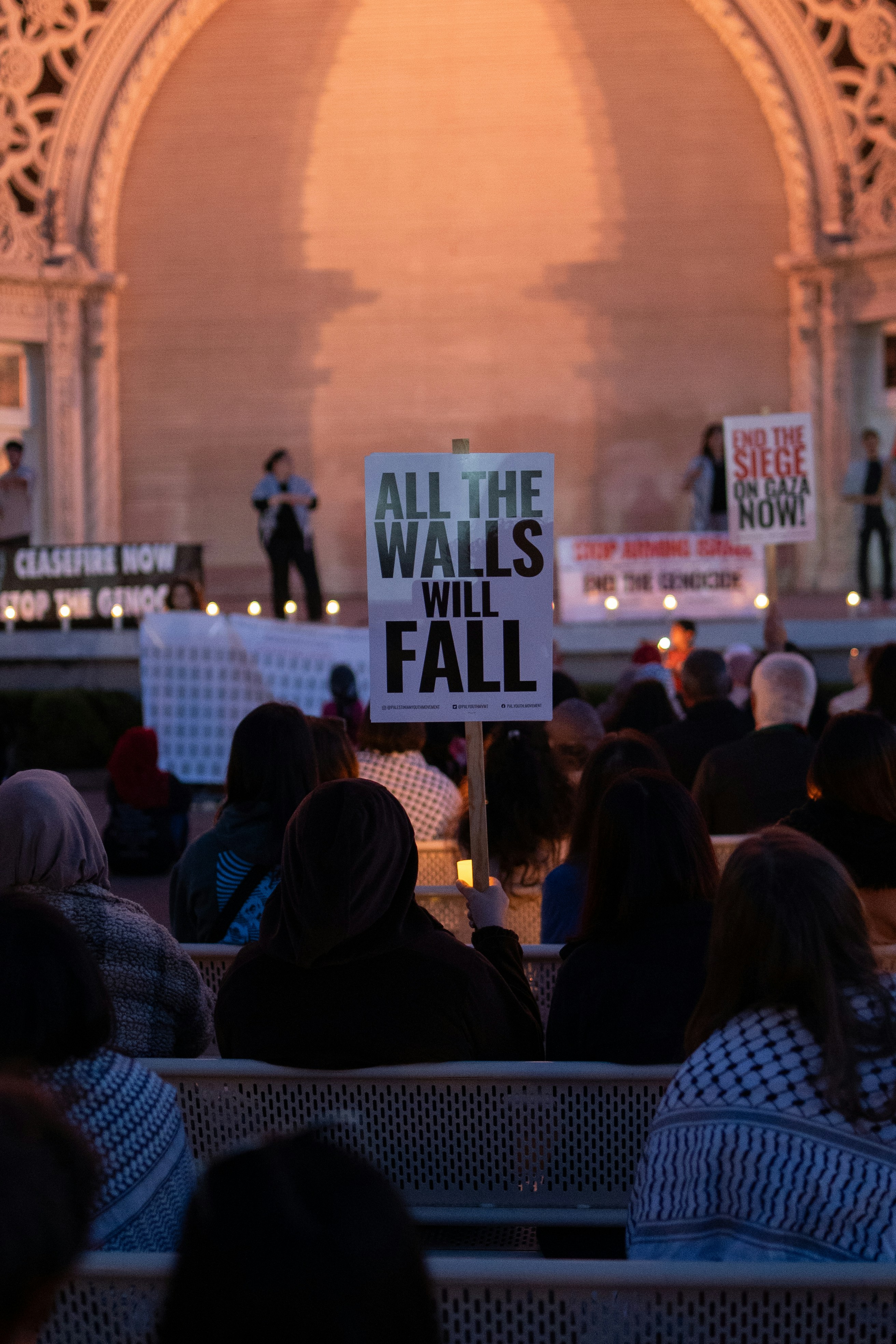 All the Walls Will Fall: A Dusk Rally Framed by Quiet Crowds