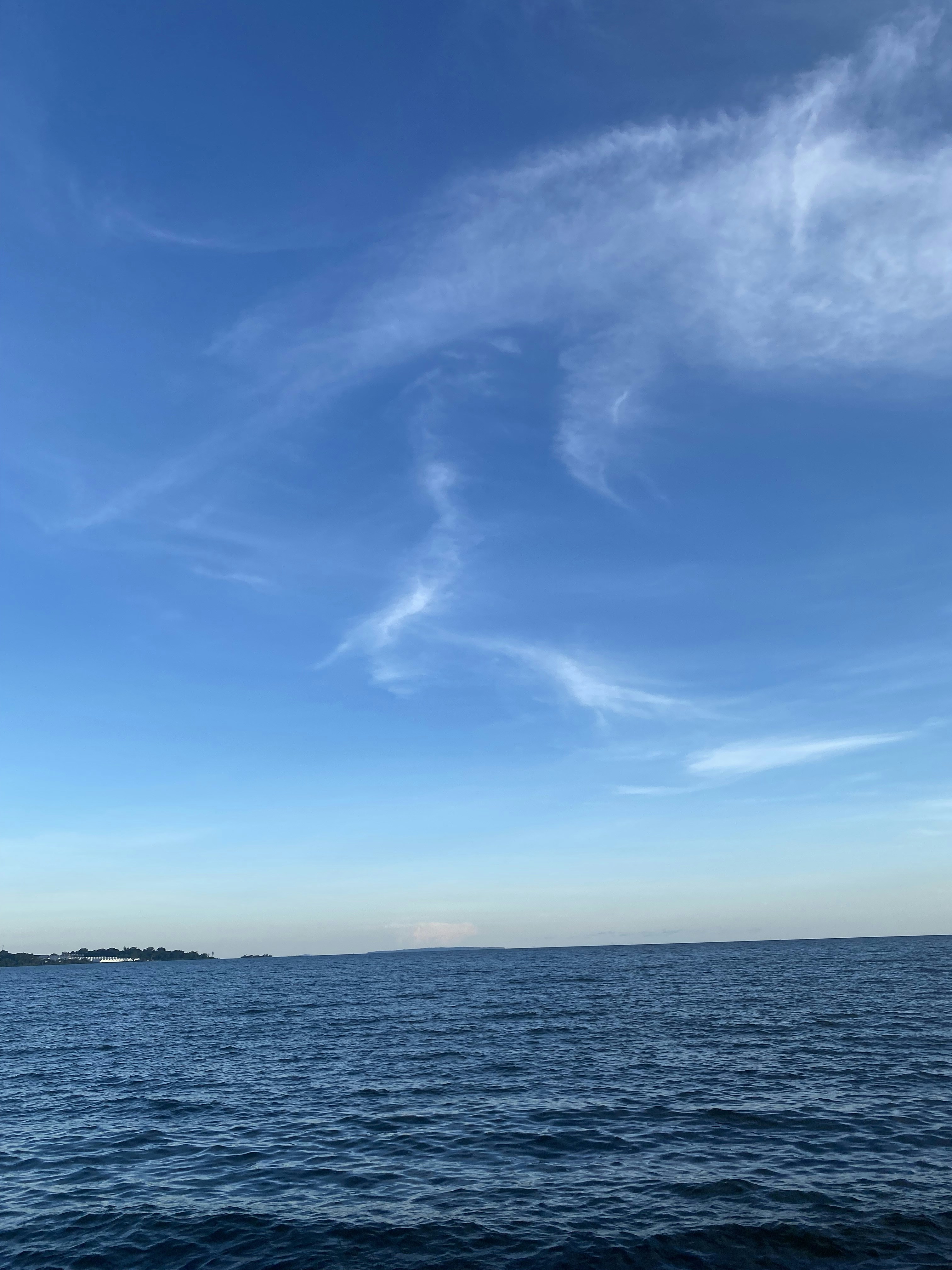 A body of water with a boat in the distance photo – Free Lake victoria ...