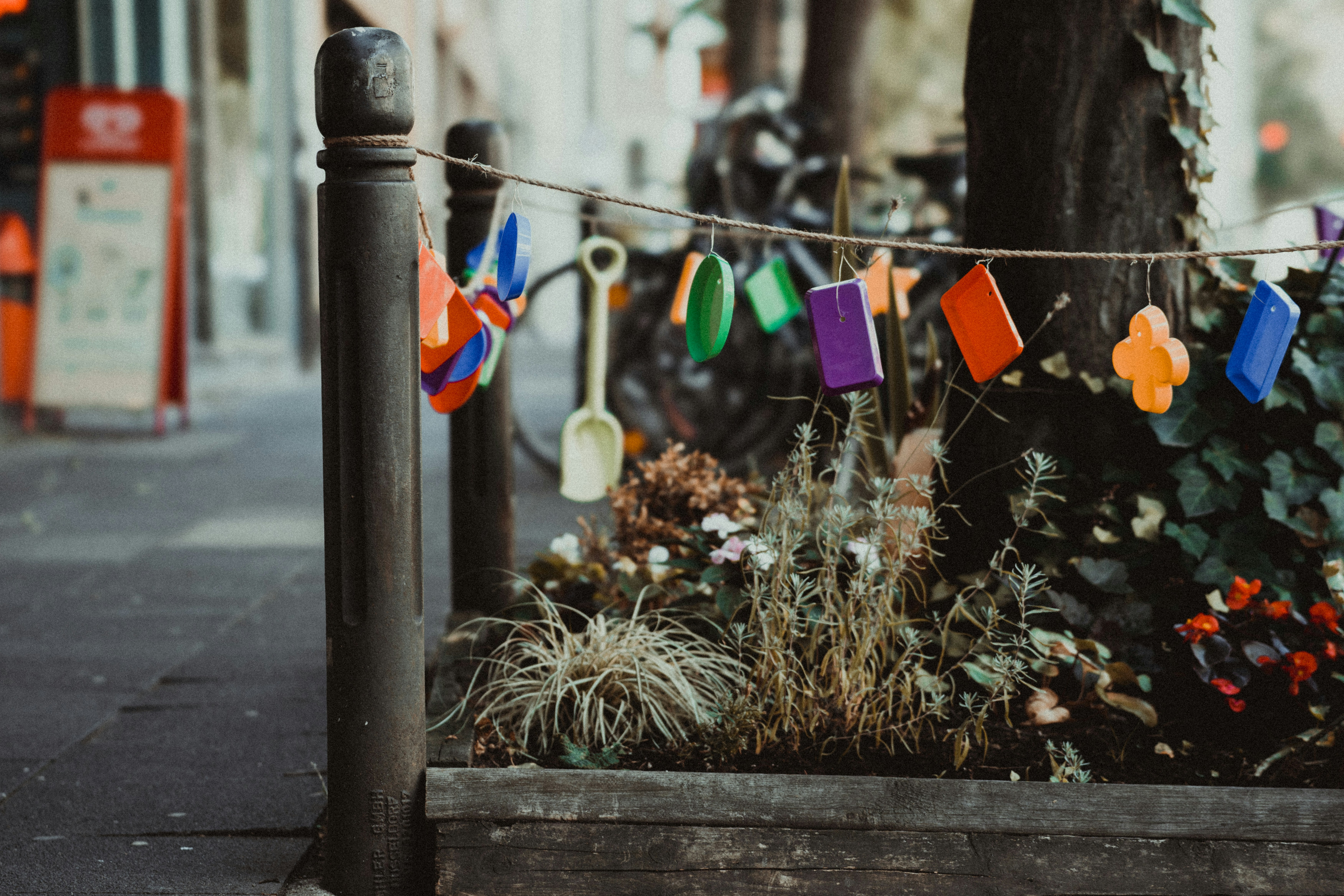 A street scene with focus on the colorful flags photo – Free Cologne ...
