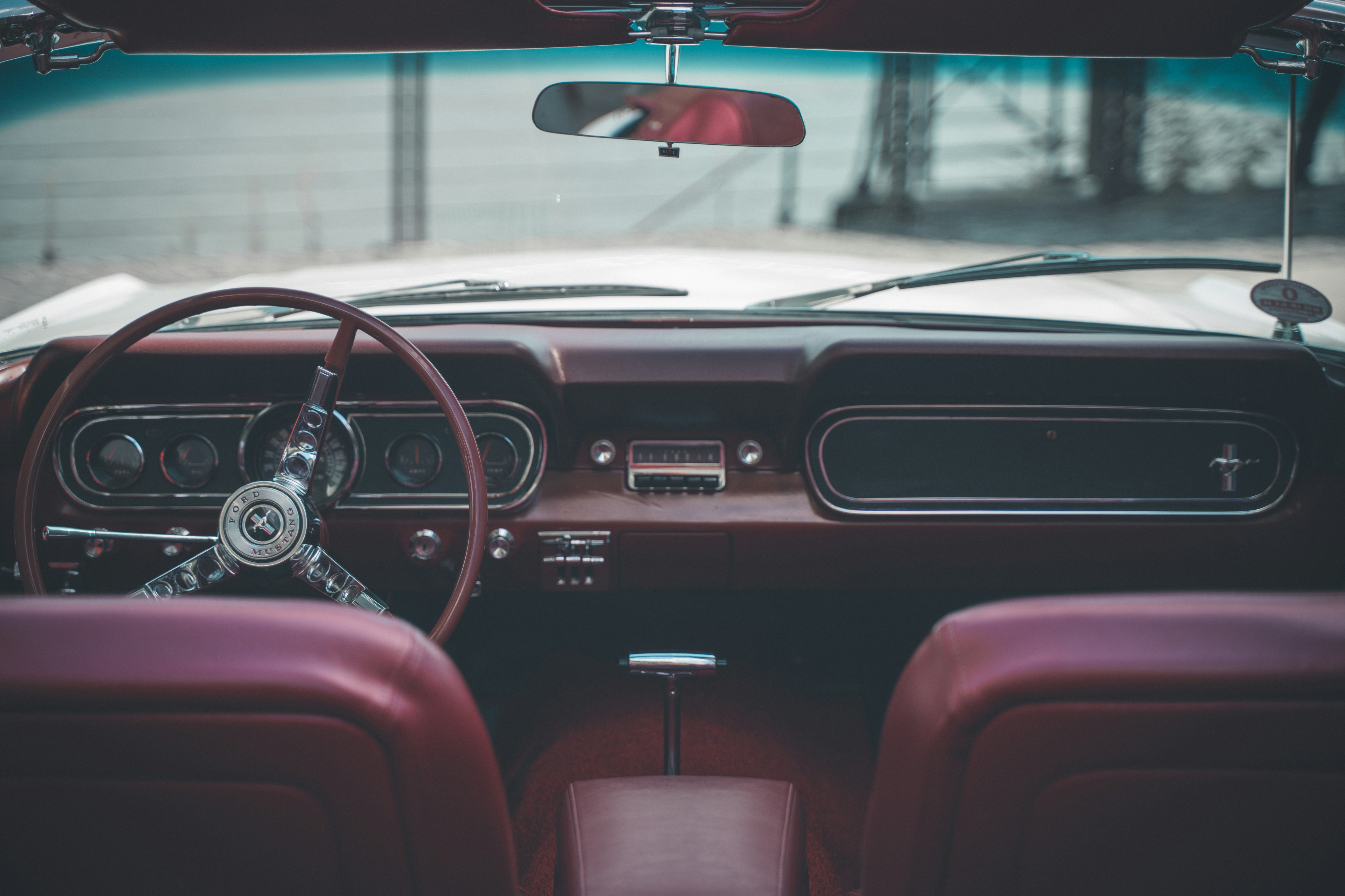 The interior of a car with a steering wheel and dashboard photo – Free ...