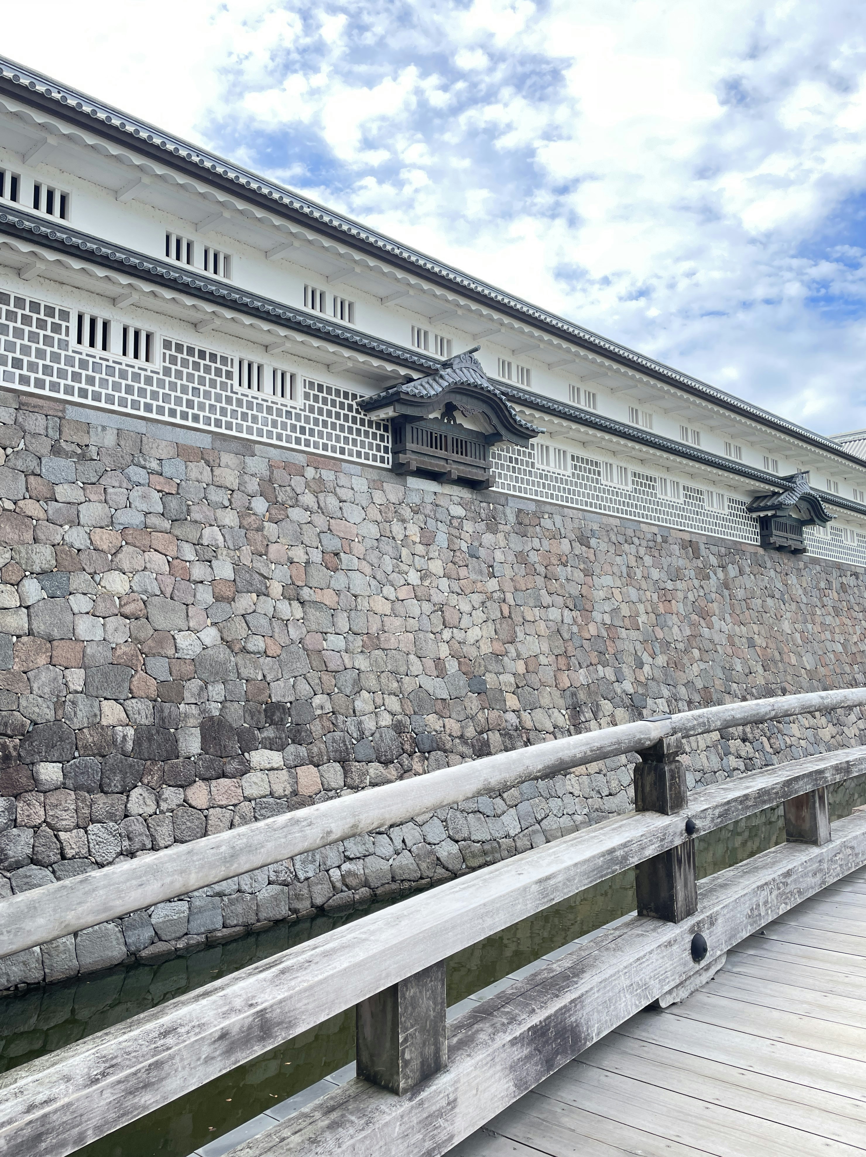 Stone Wall Horizon: A Timeless Japanese Fortification and Wooden Walkway