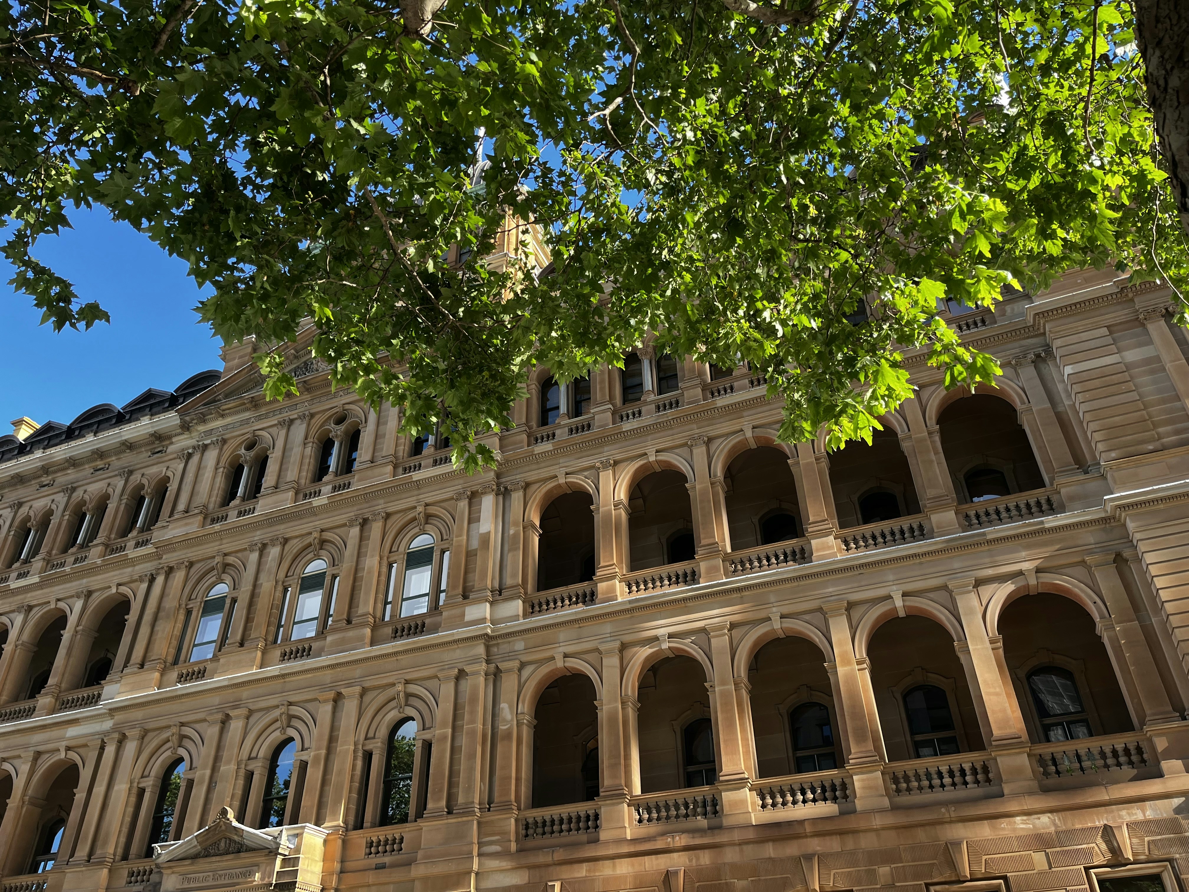 A large building with a clock tower on top of it photo – Free Building ...