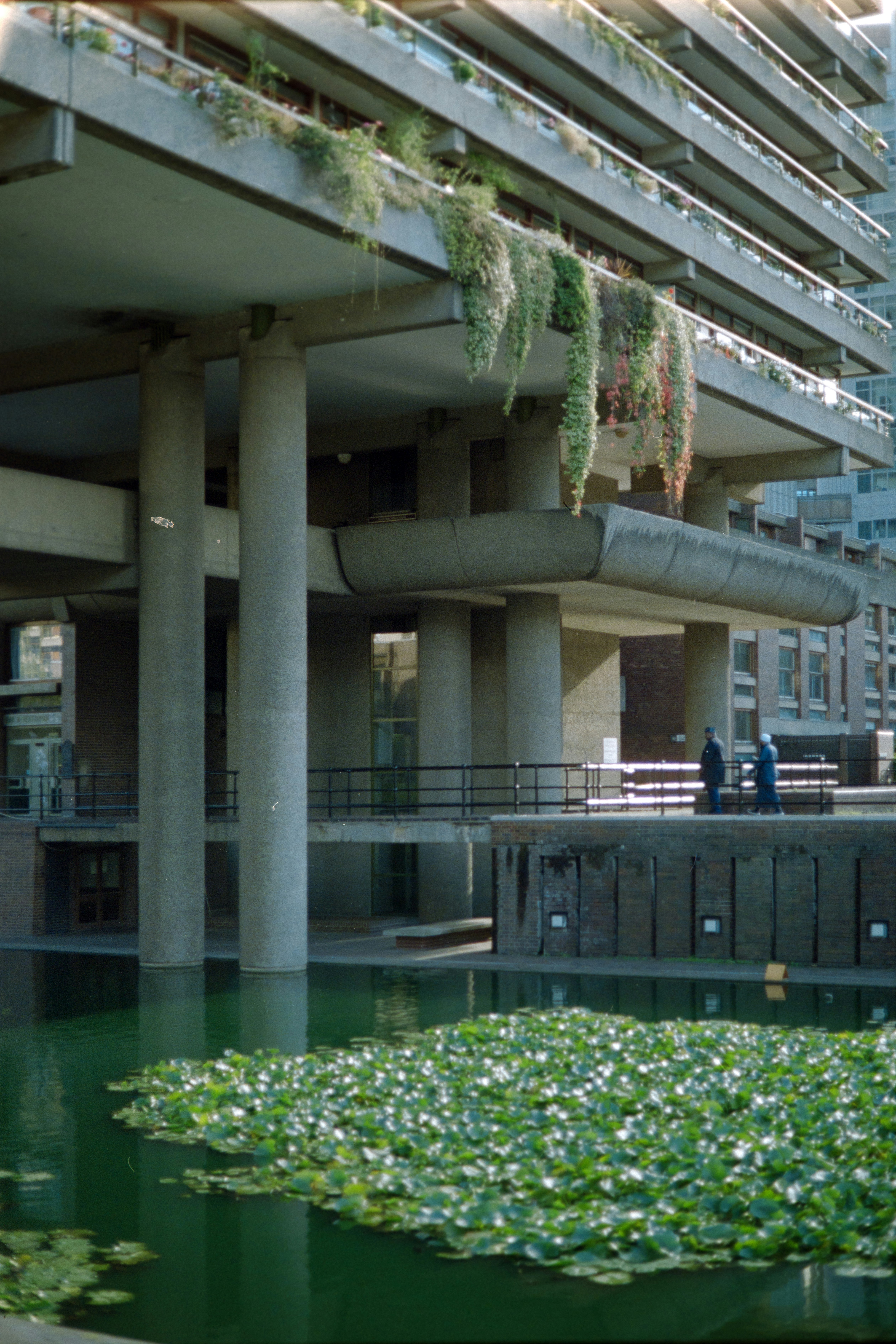A building with a pond in front of it photo – Free Barbican centre ...