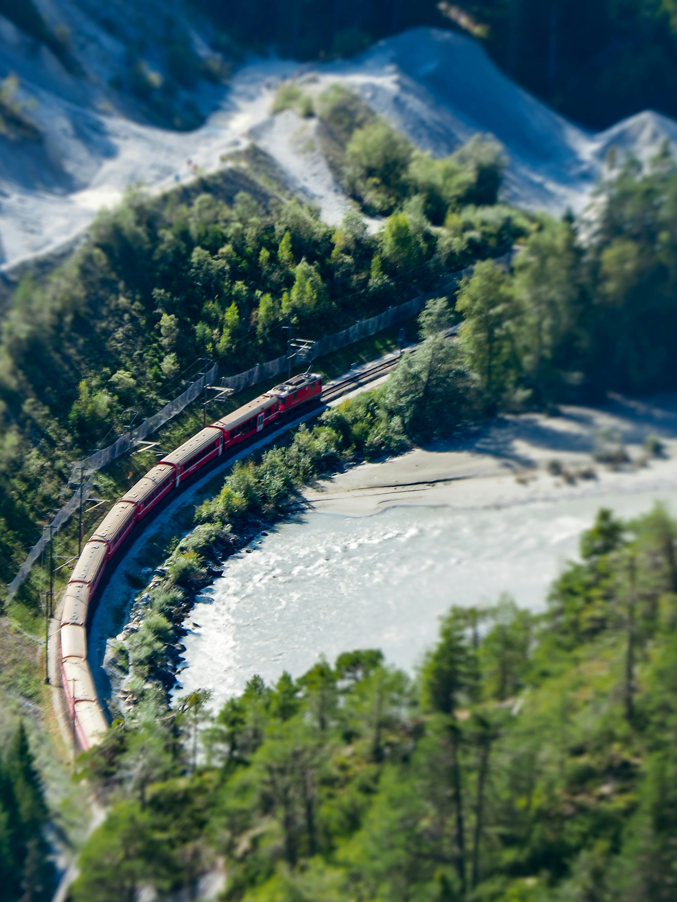 Red Locomotive on a Sinuous Forest Spiral