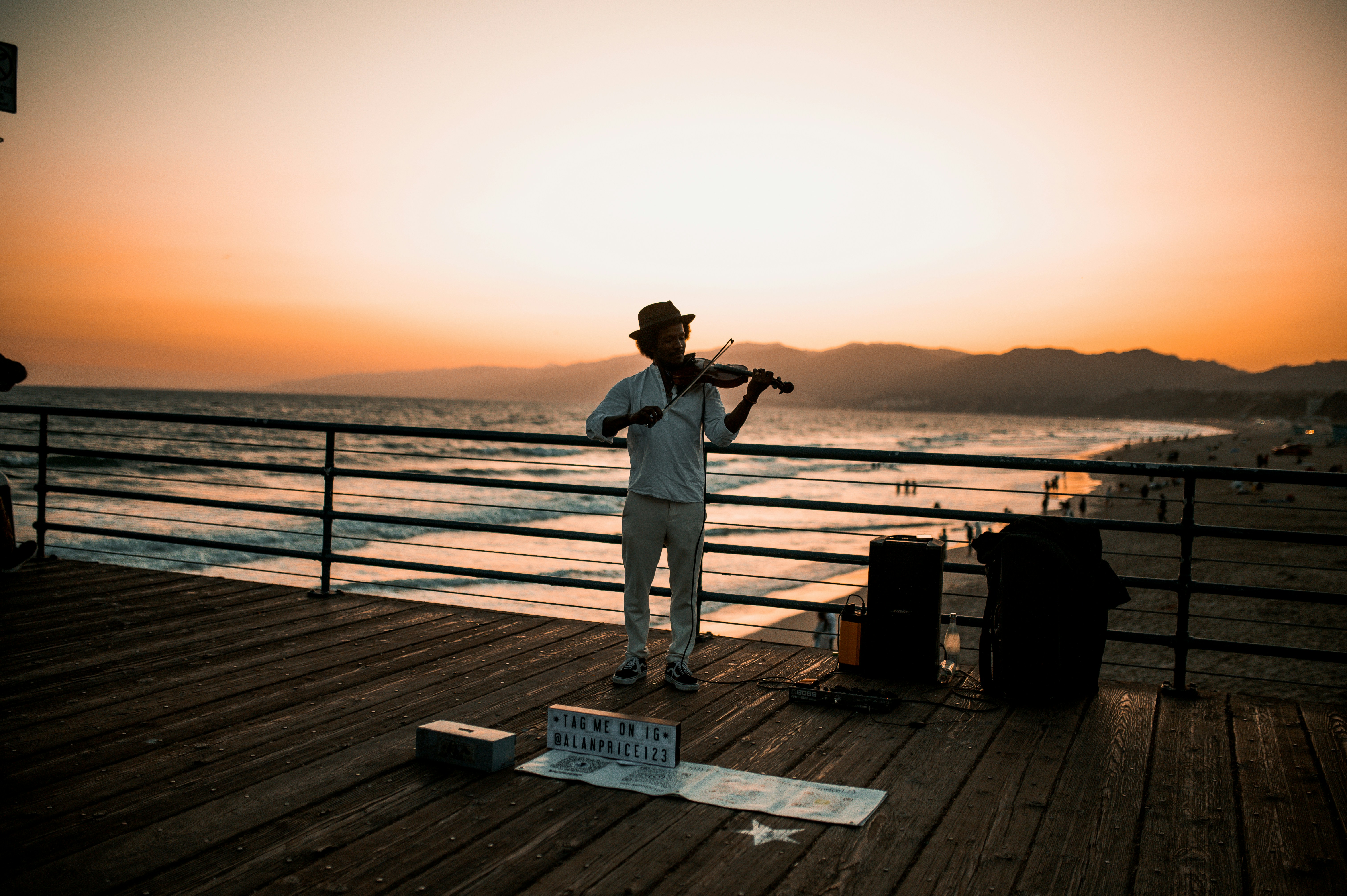 Sunset Serenade on the Pier: A Silhouette at Dusk