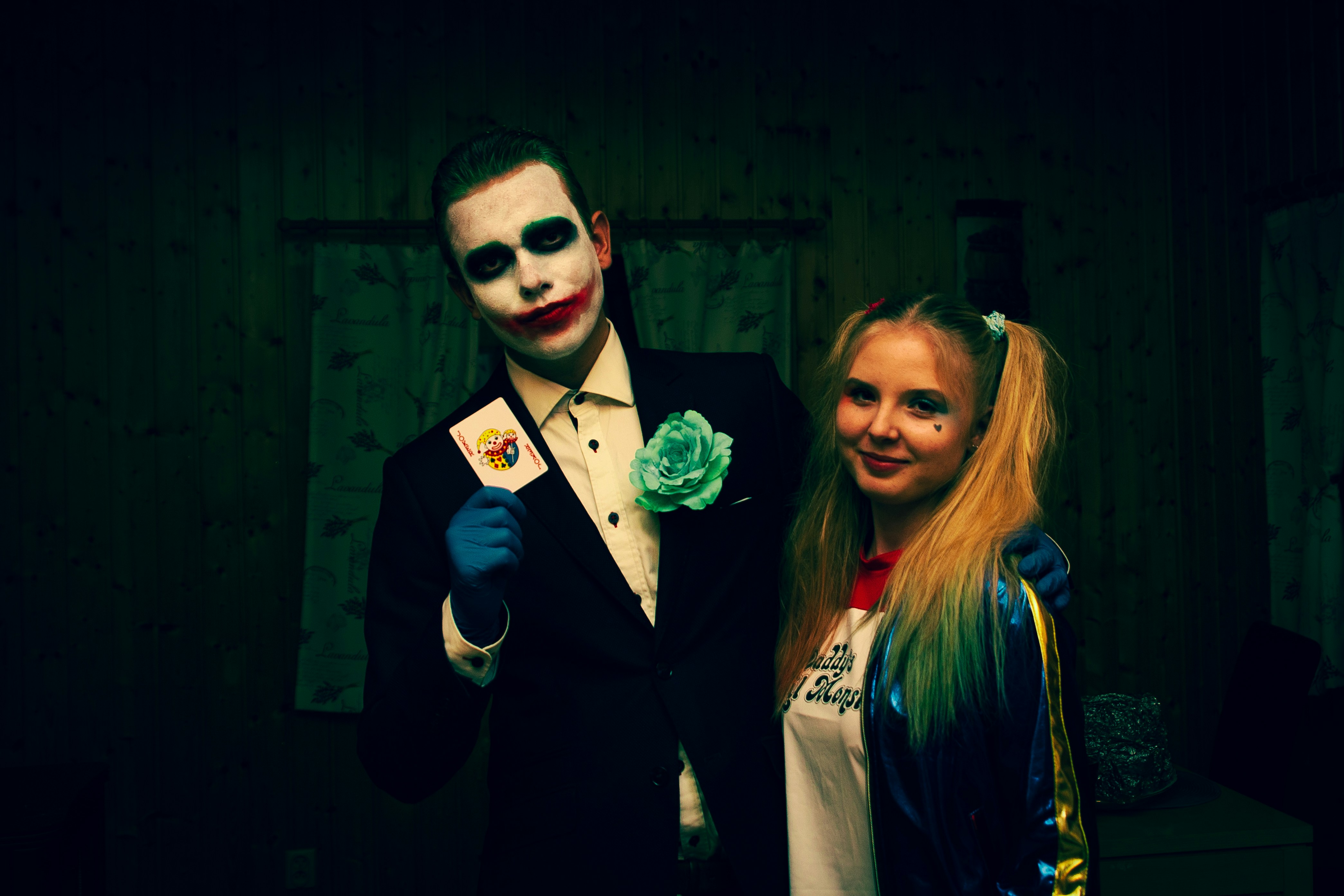 Joker and Neon Blonde: A Dimly Lit Cosplay Moment