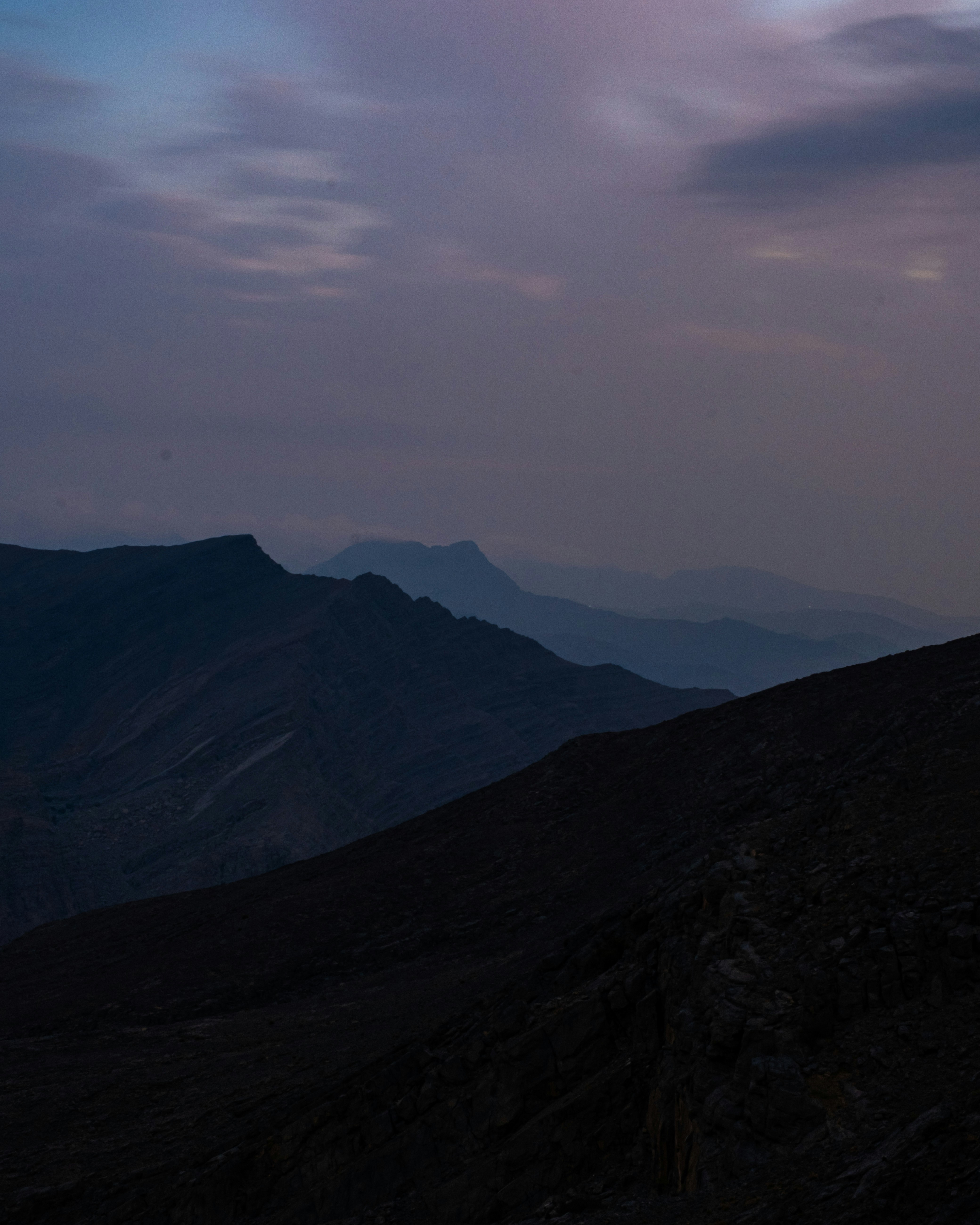 Blue-Hour Ridge: silhouettes stacking into the violet haze