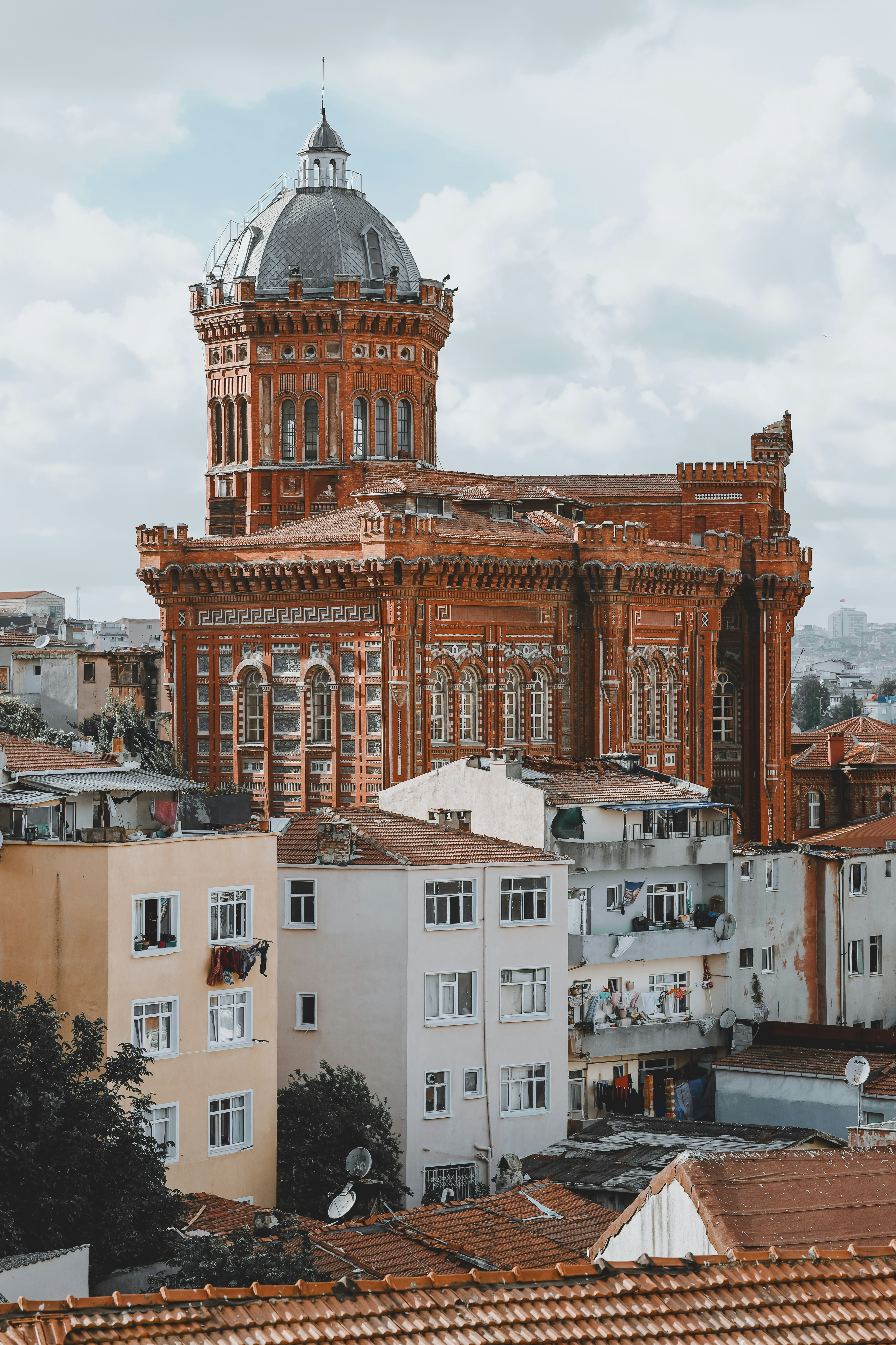Brick-Domed Tower Crowned Over a Patchwork City Rooftop