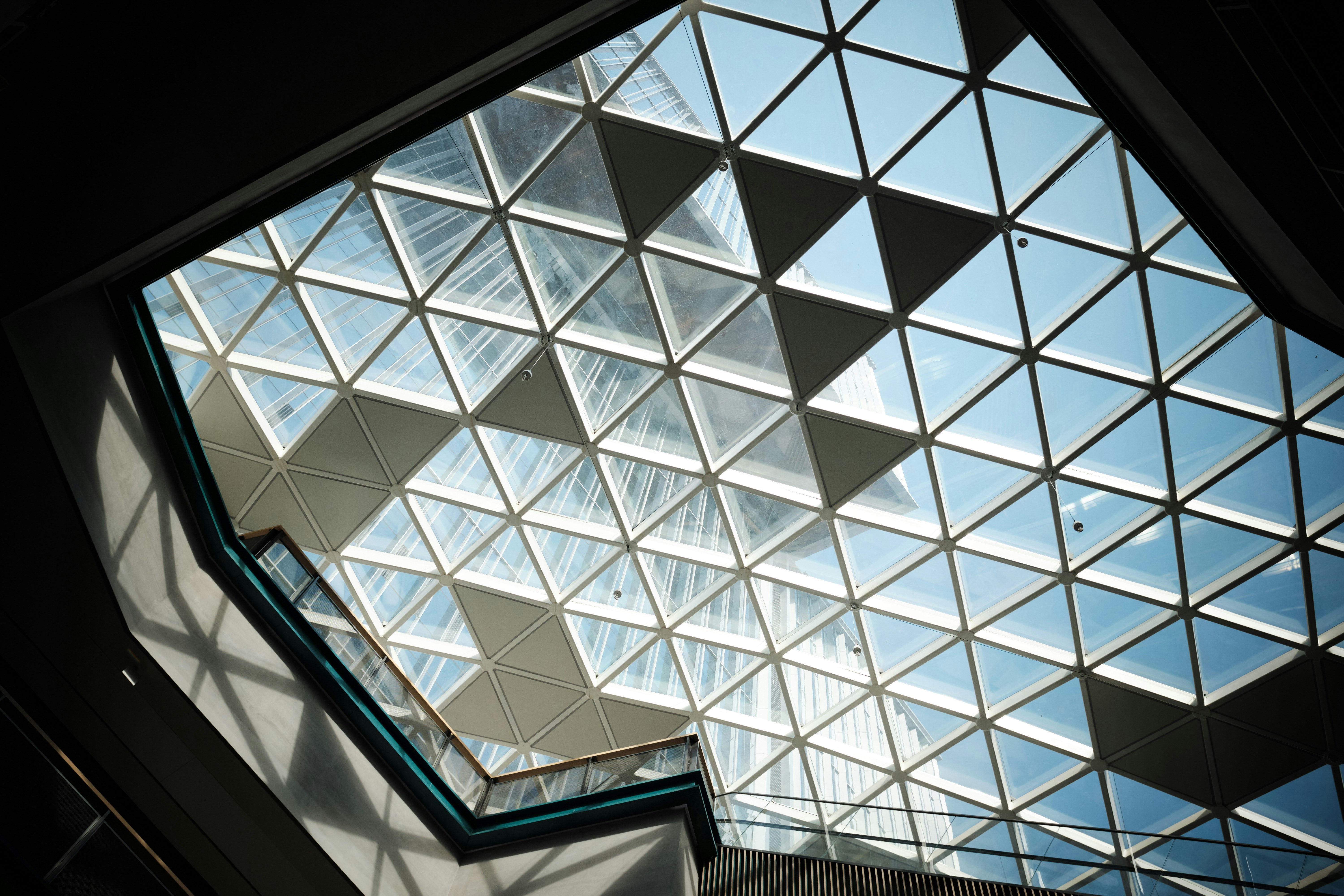 A very tall building with a skylight above it photo – Free Triangles ...
