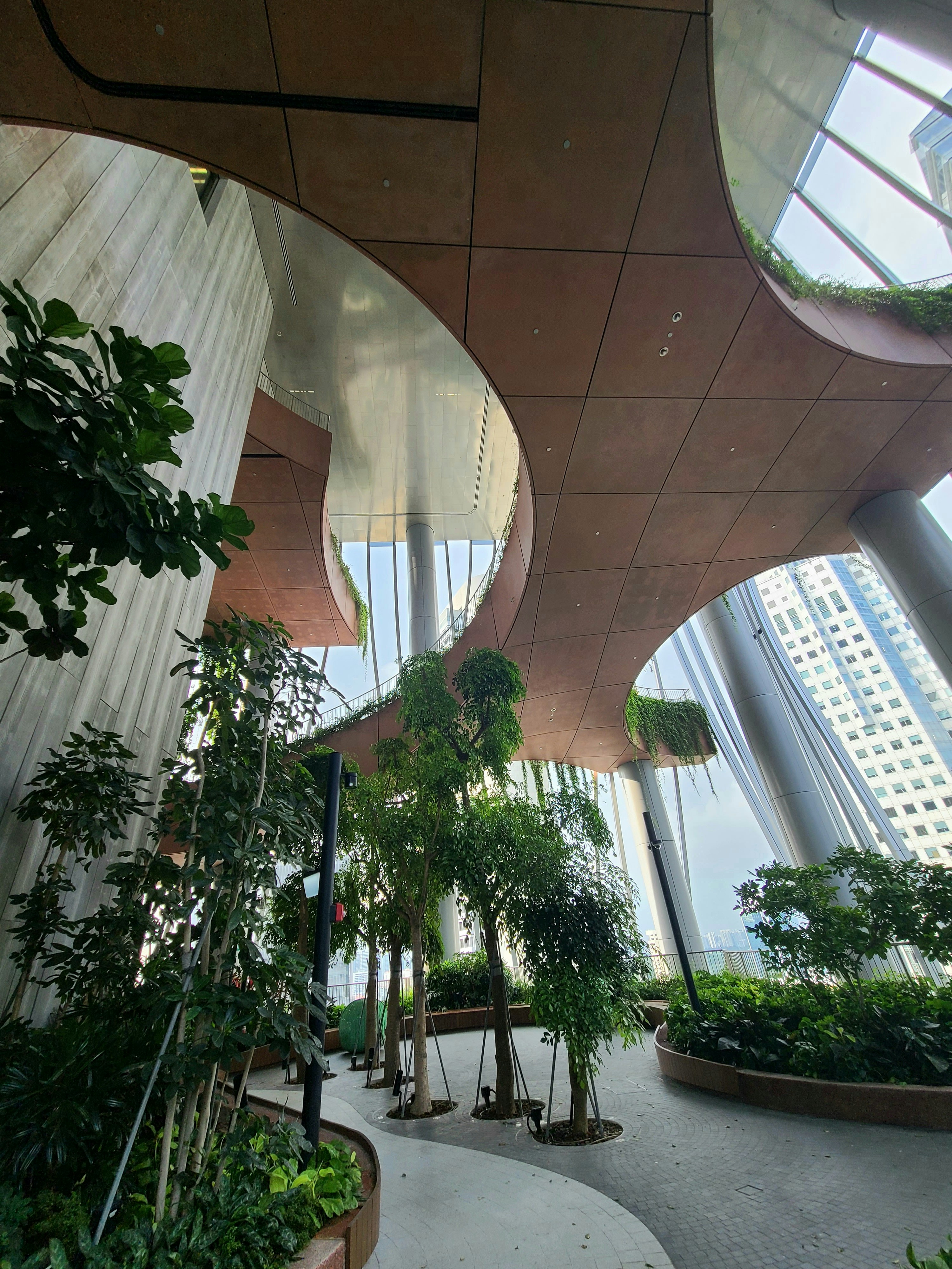 A building with a lot of plants inside of it photo – Free Market street ...