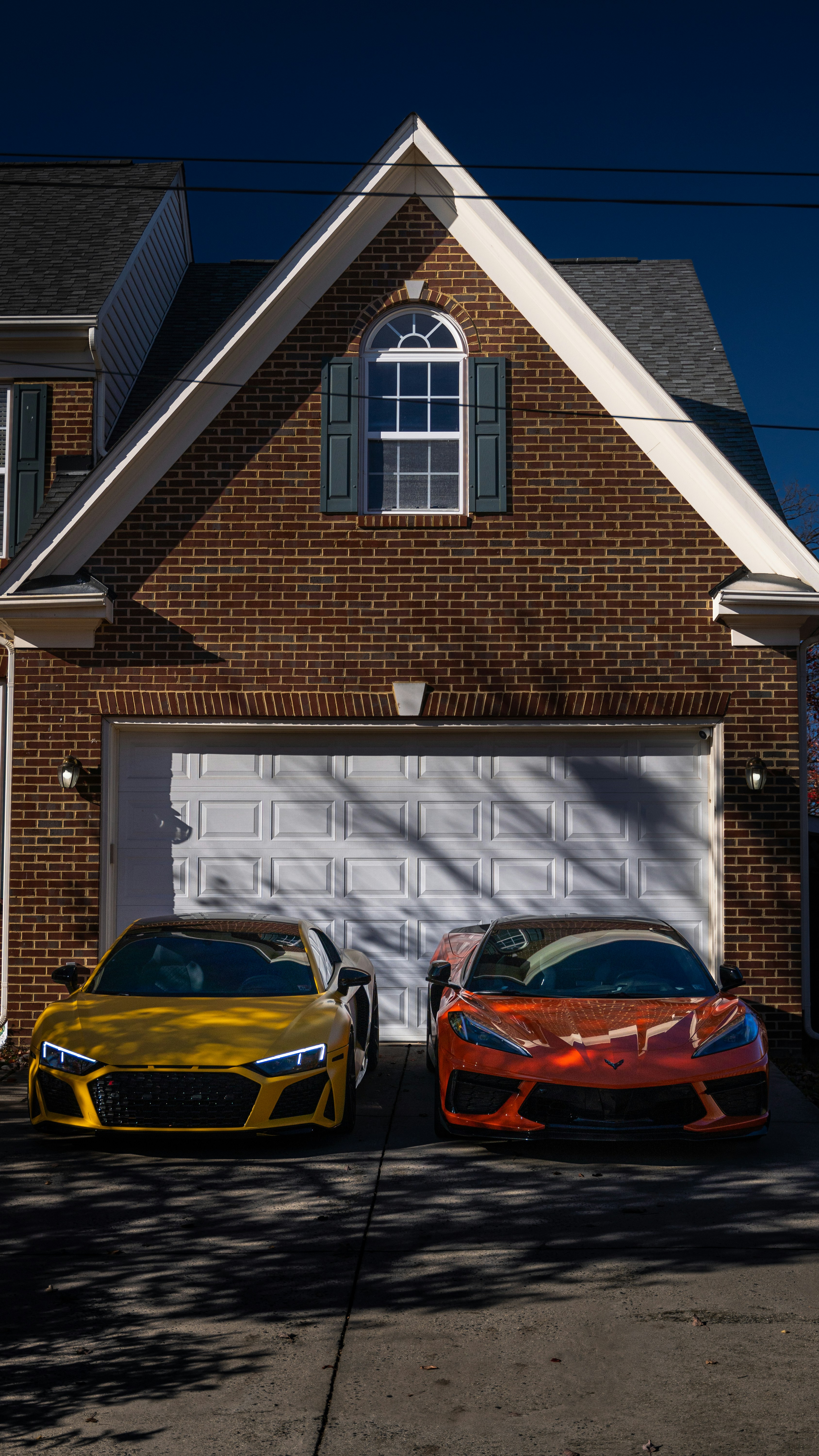 A couple of cars parked in front of a house photo – Free Audi r8 Image ...